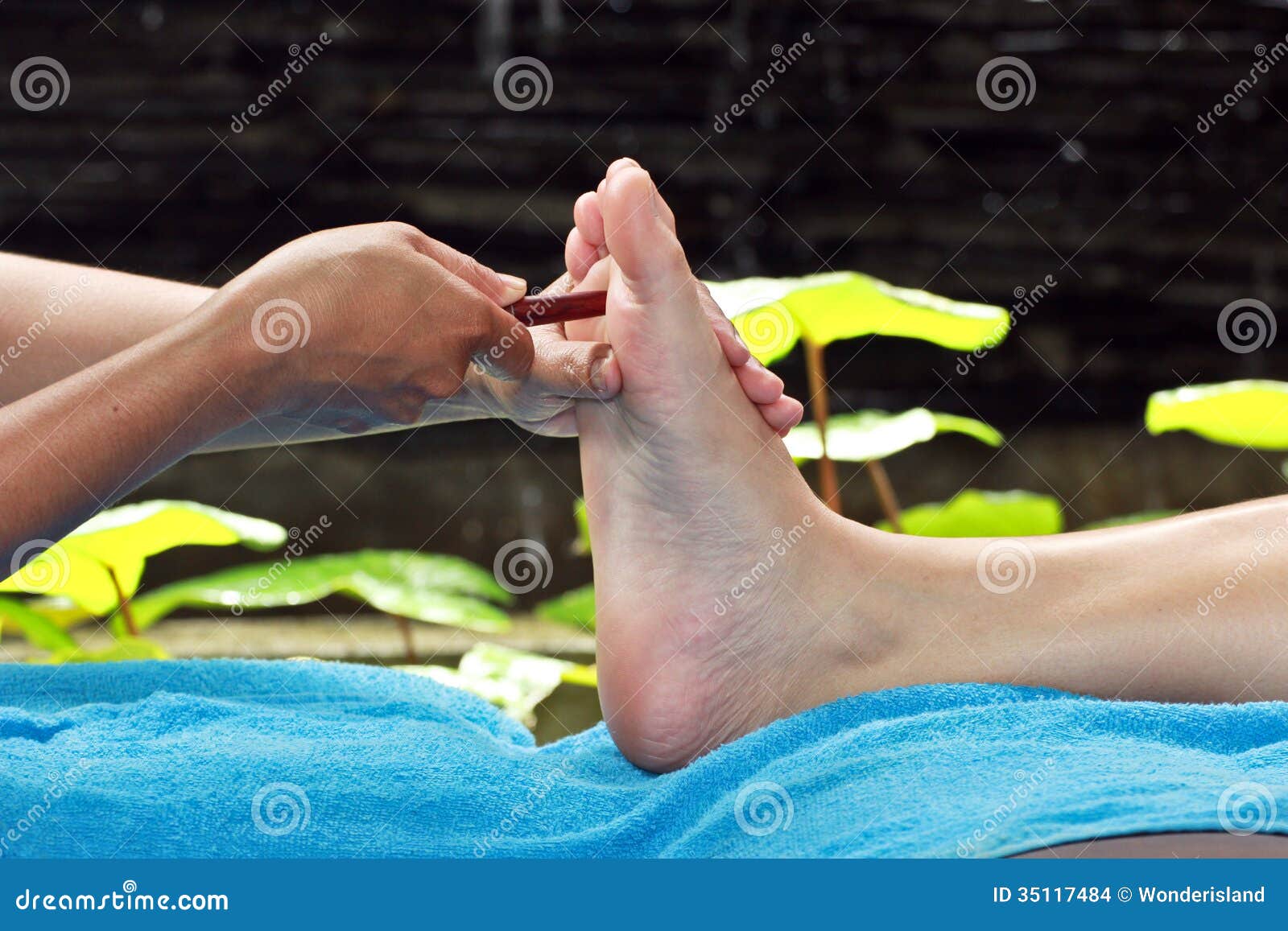 Foot massage by wood stick stock photo. Image of aromatherapy - 35117484