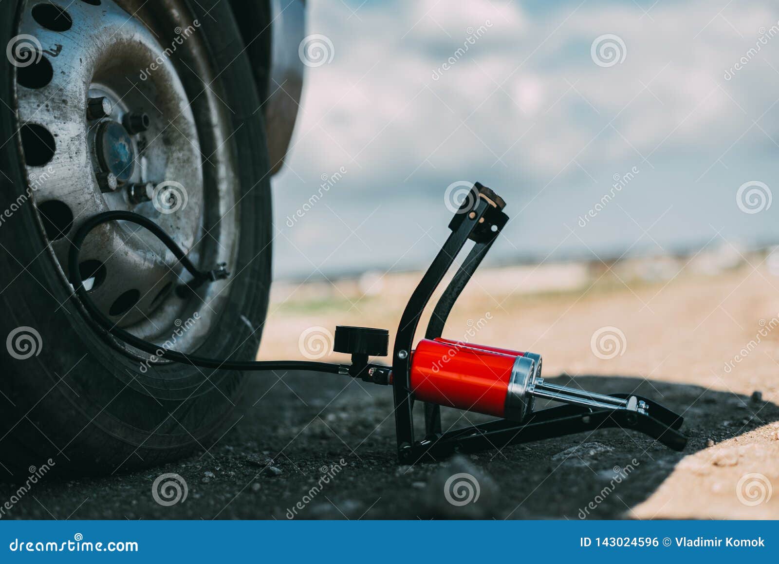 Foot Pump on the Floor Next To the Car and Wheel Stock Photo - Image of ...