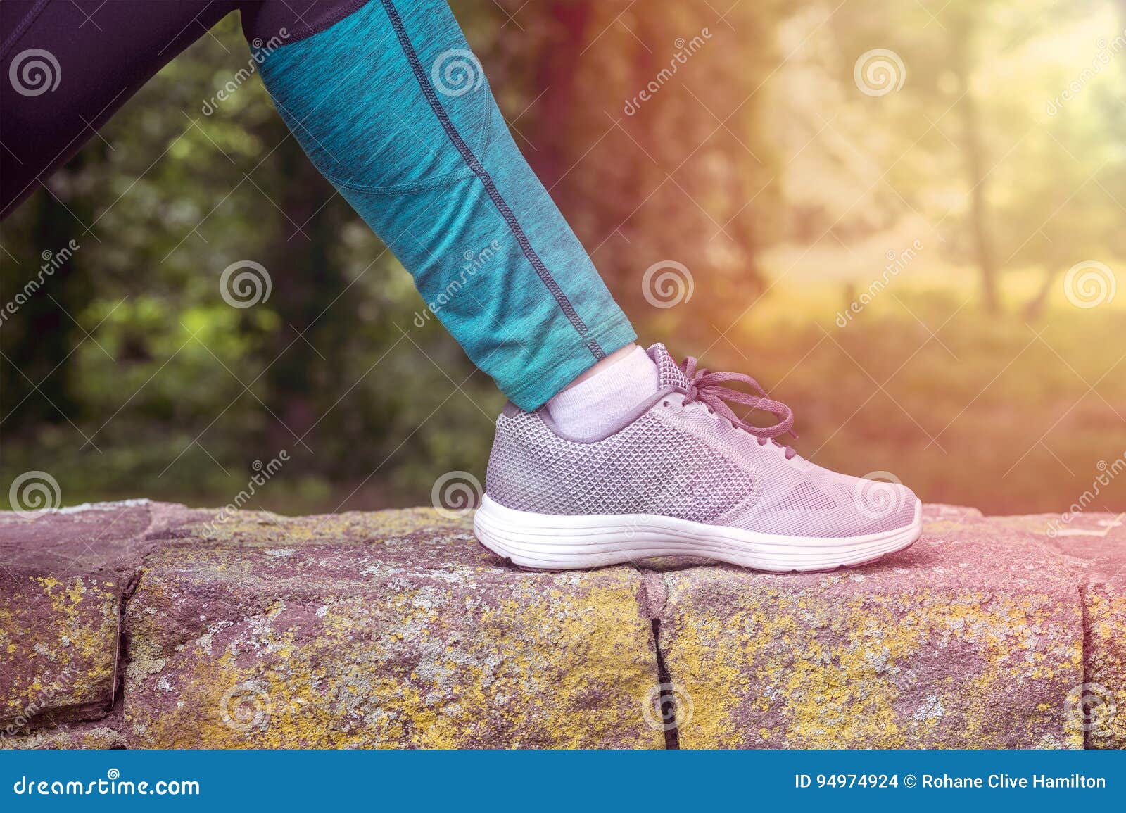 Foot resting on stone wall stock photo. Image of girl - 94974924