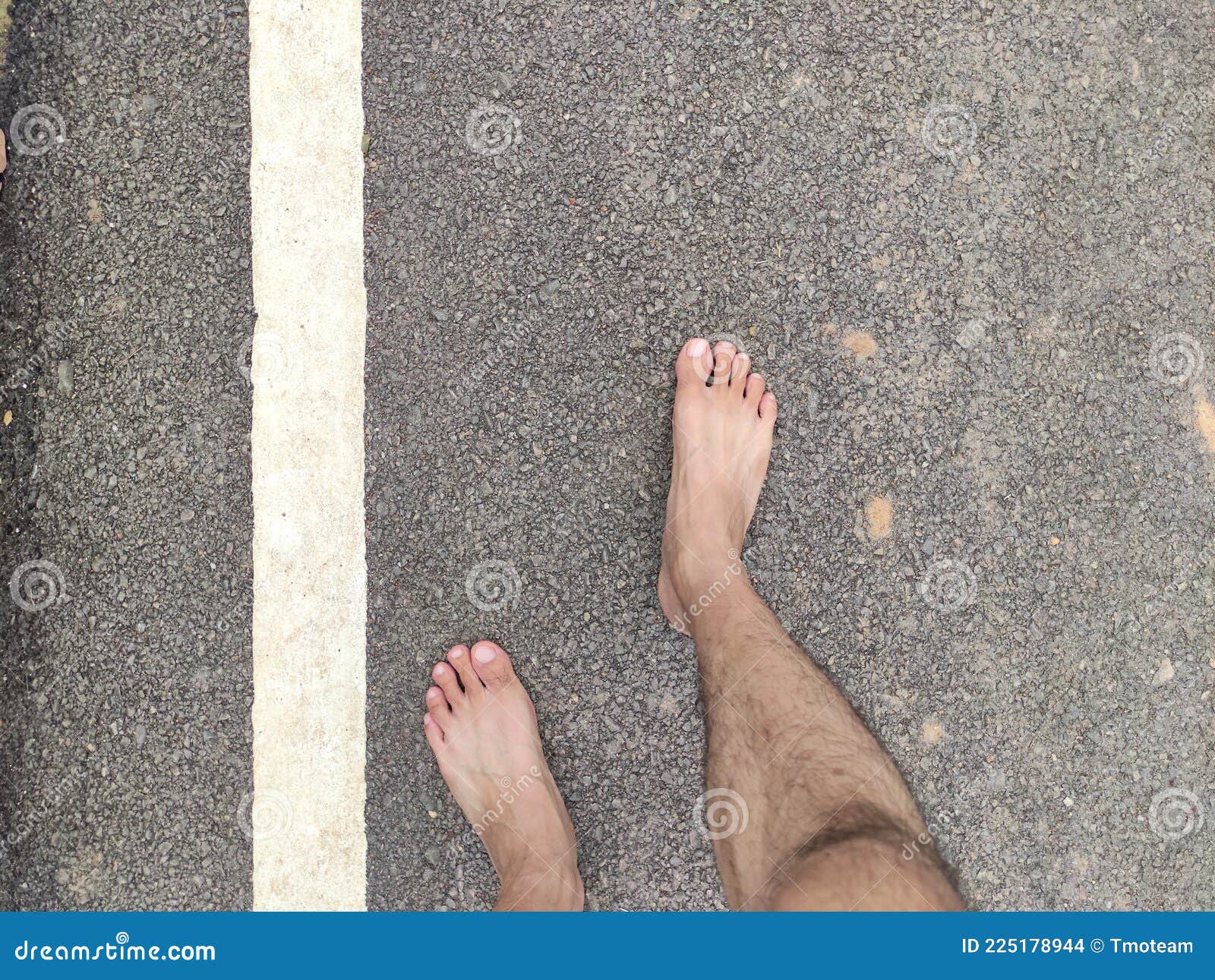 Foot step on asphalt road stock photo. Image of design - 225178944