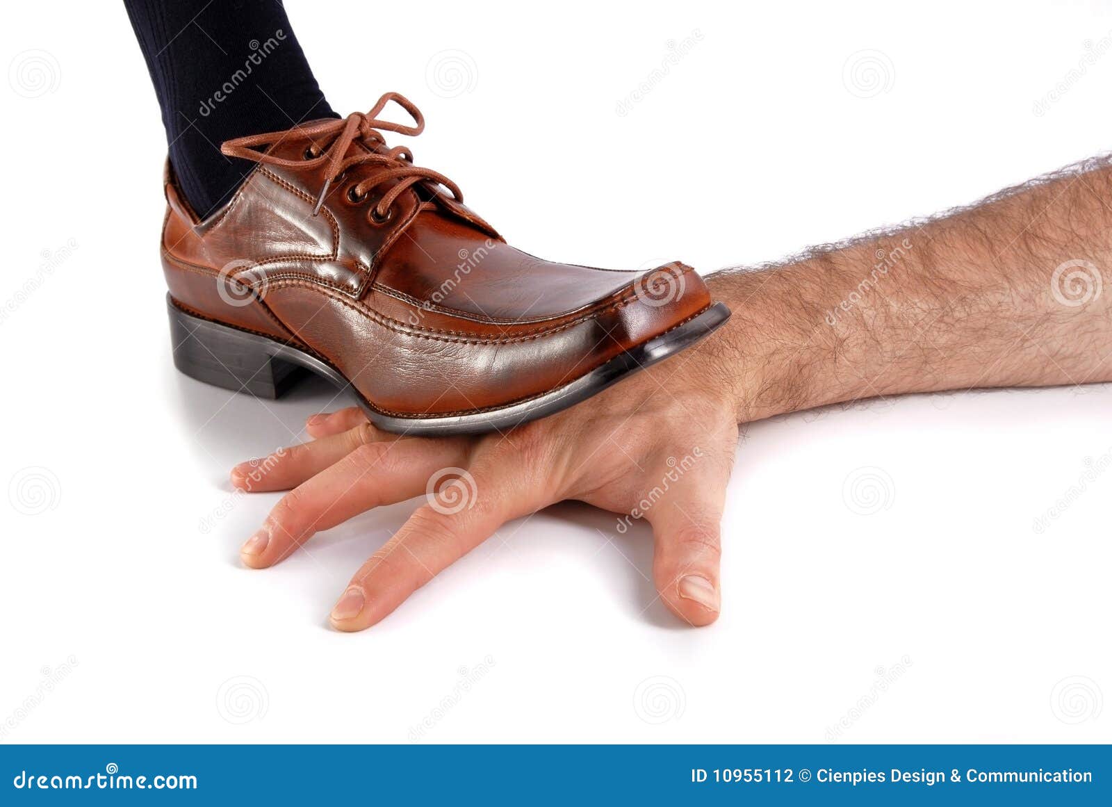 Foot stepping on a hand stock photo. Image of worker - 10955112