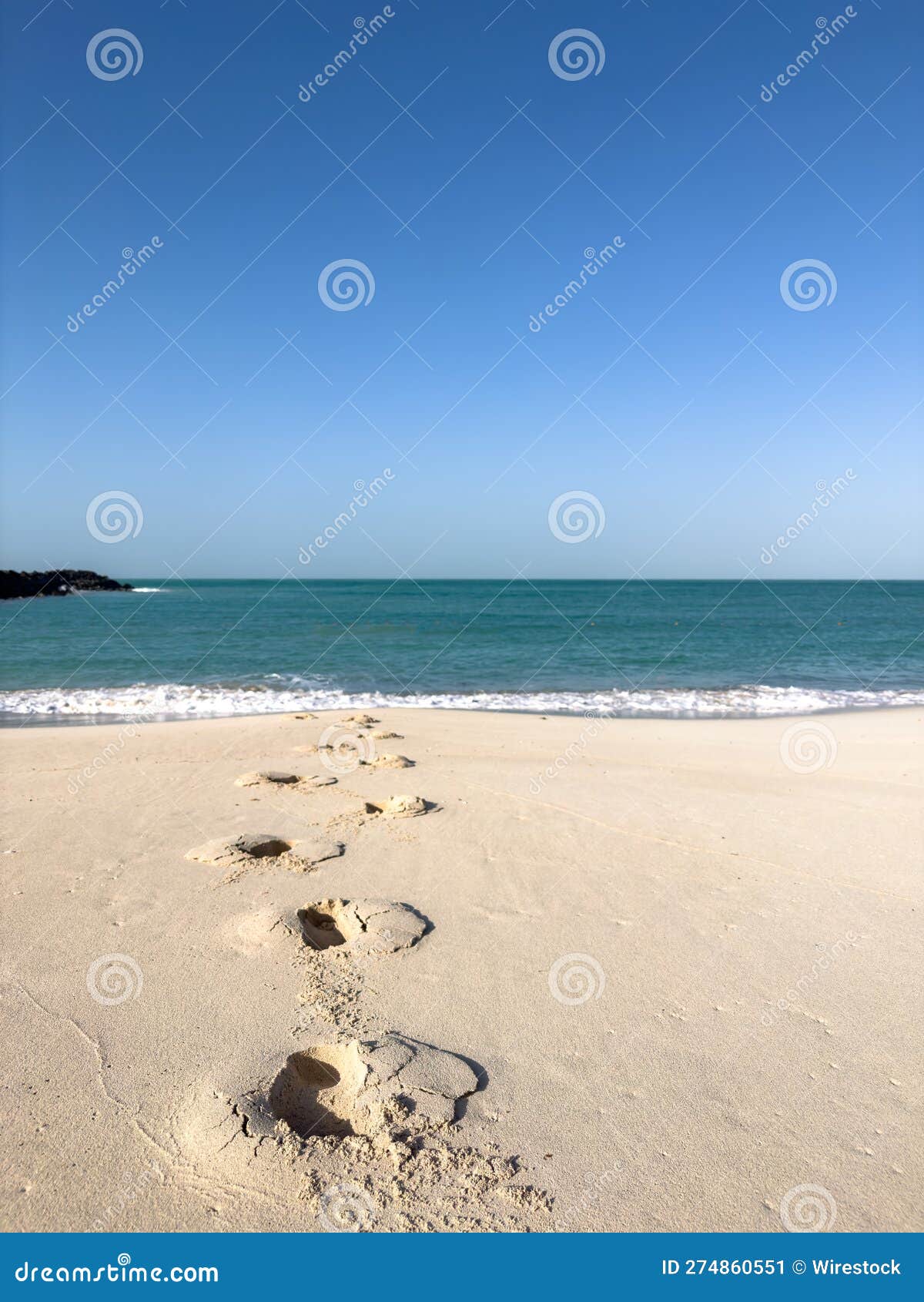 Foot steps in beach sand stock image. Image of shore - 274860551