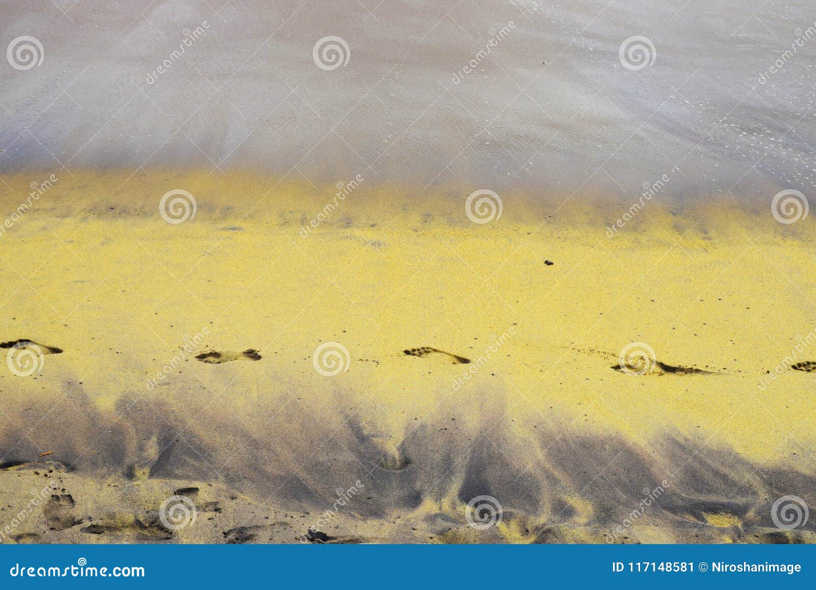 Foot steps on sand beach stock image. Image of stream - 117148581