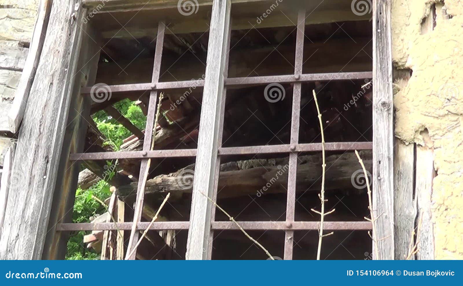 The Old Broken Window with Bars on the Old Cottage Stock Footage ...