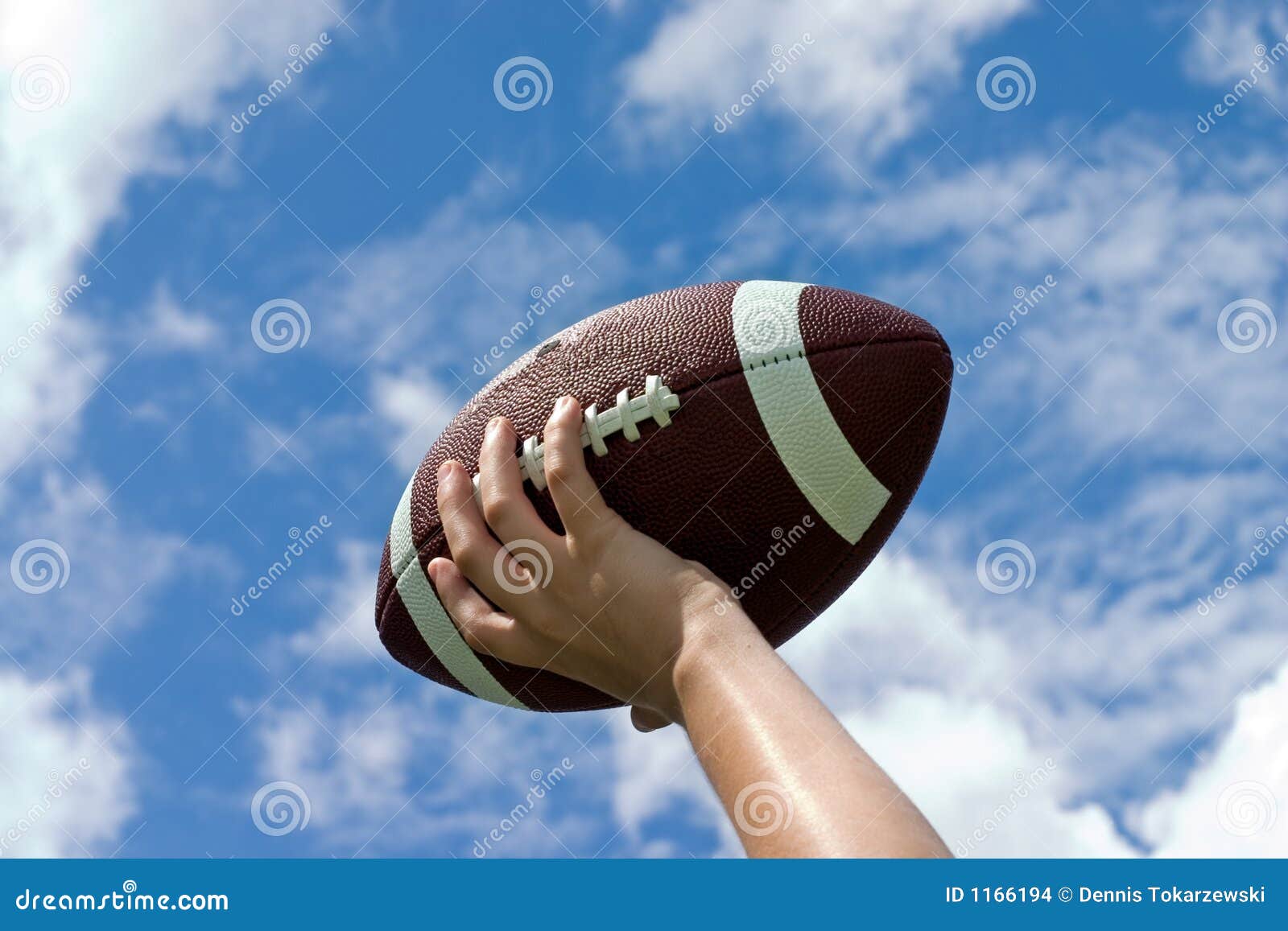 Football against Sky stock photo. Image of hand, atmosphere - 1166194