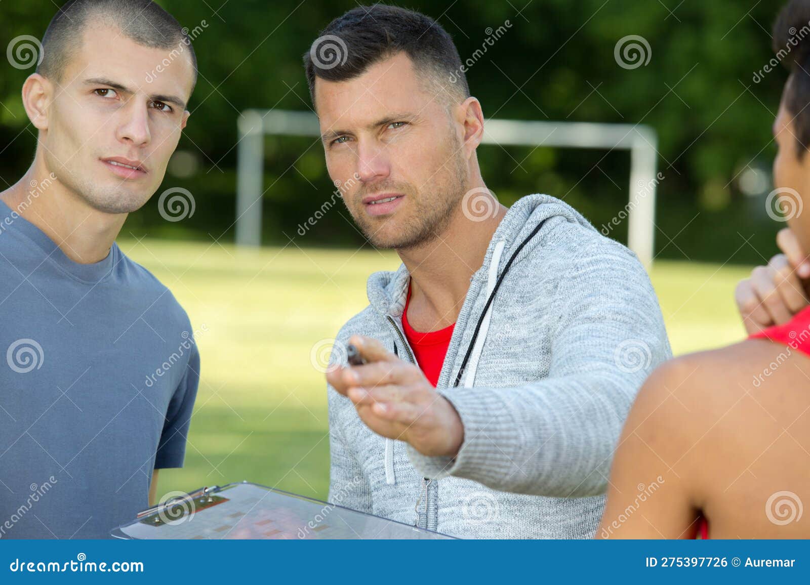 Football coach with player stock photo. Image of challenge - 275397726