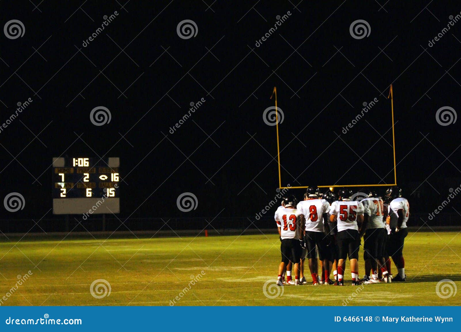 Football Huddle at Night Game Stock Photo - Image of athletic, high ...