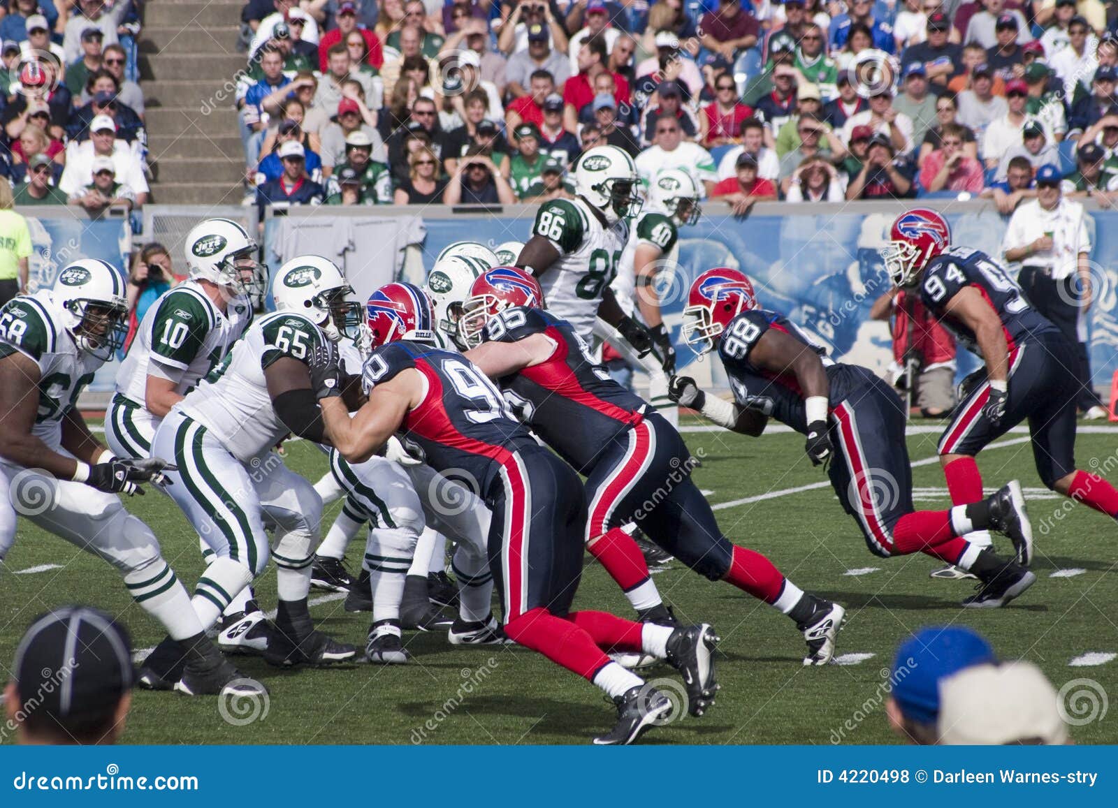 Football Line Rush editorial stock photo. Image of defensive - 4220498