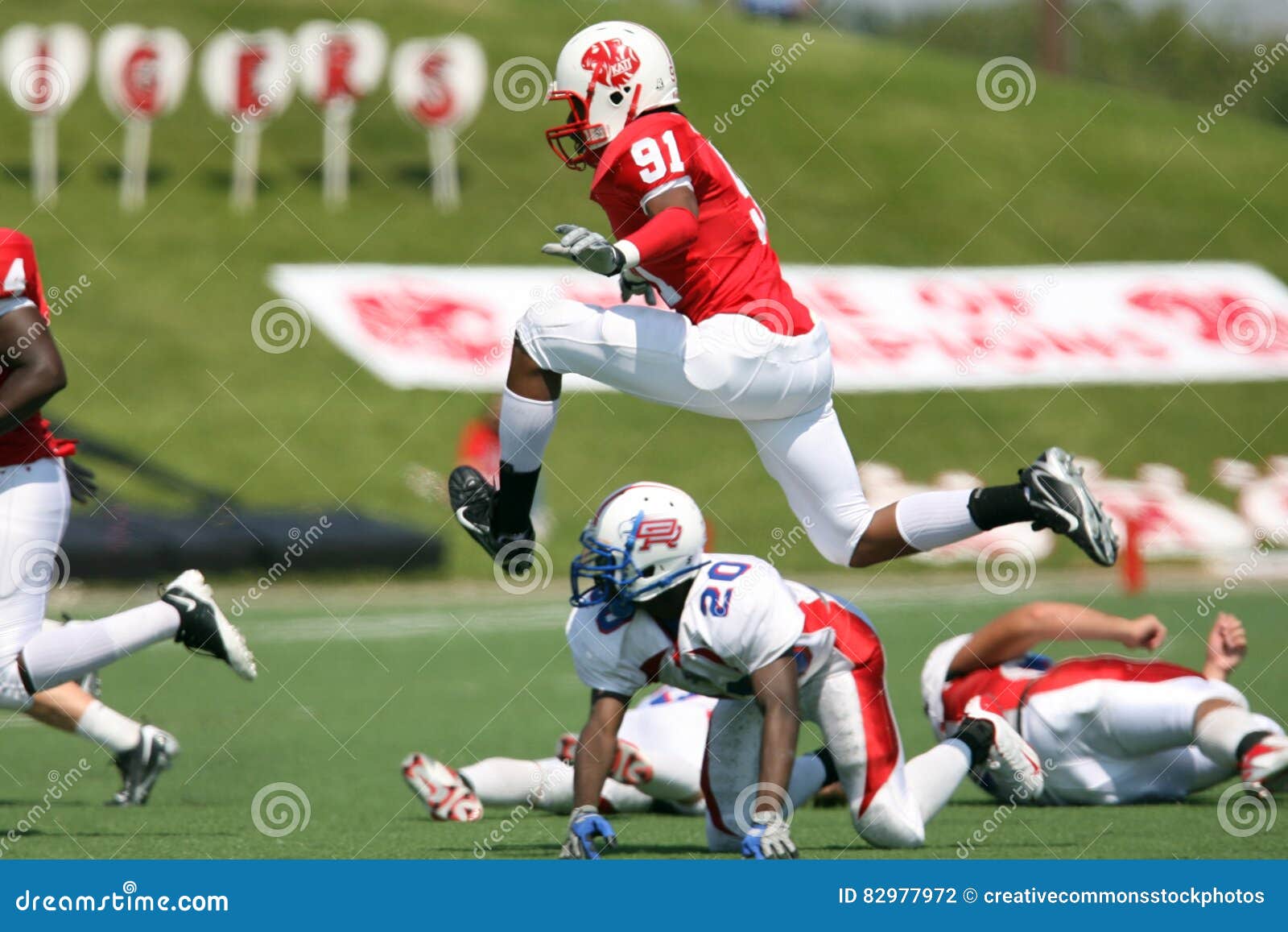 Football Player Pass By Over Reaching The Goal Picture. Image: 82977972