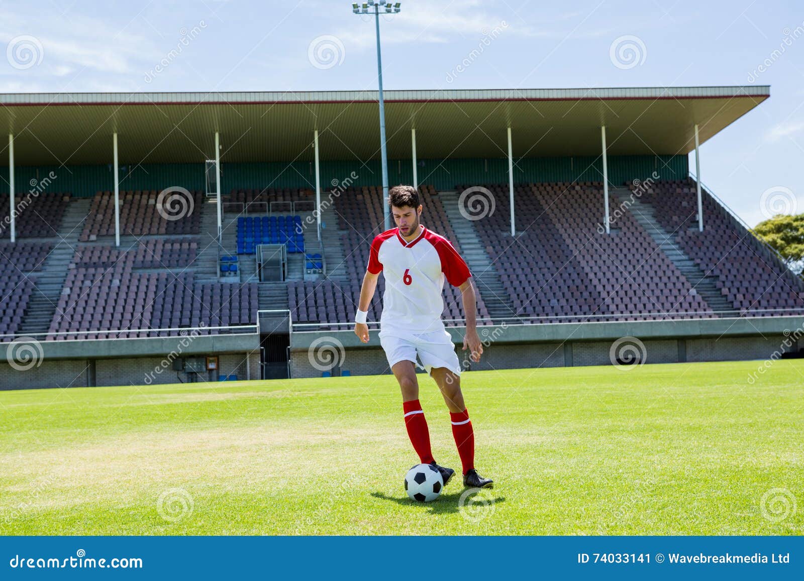 Football Player Practicing Soccer Stock Image - Image of warm ...