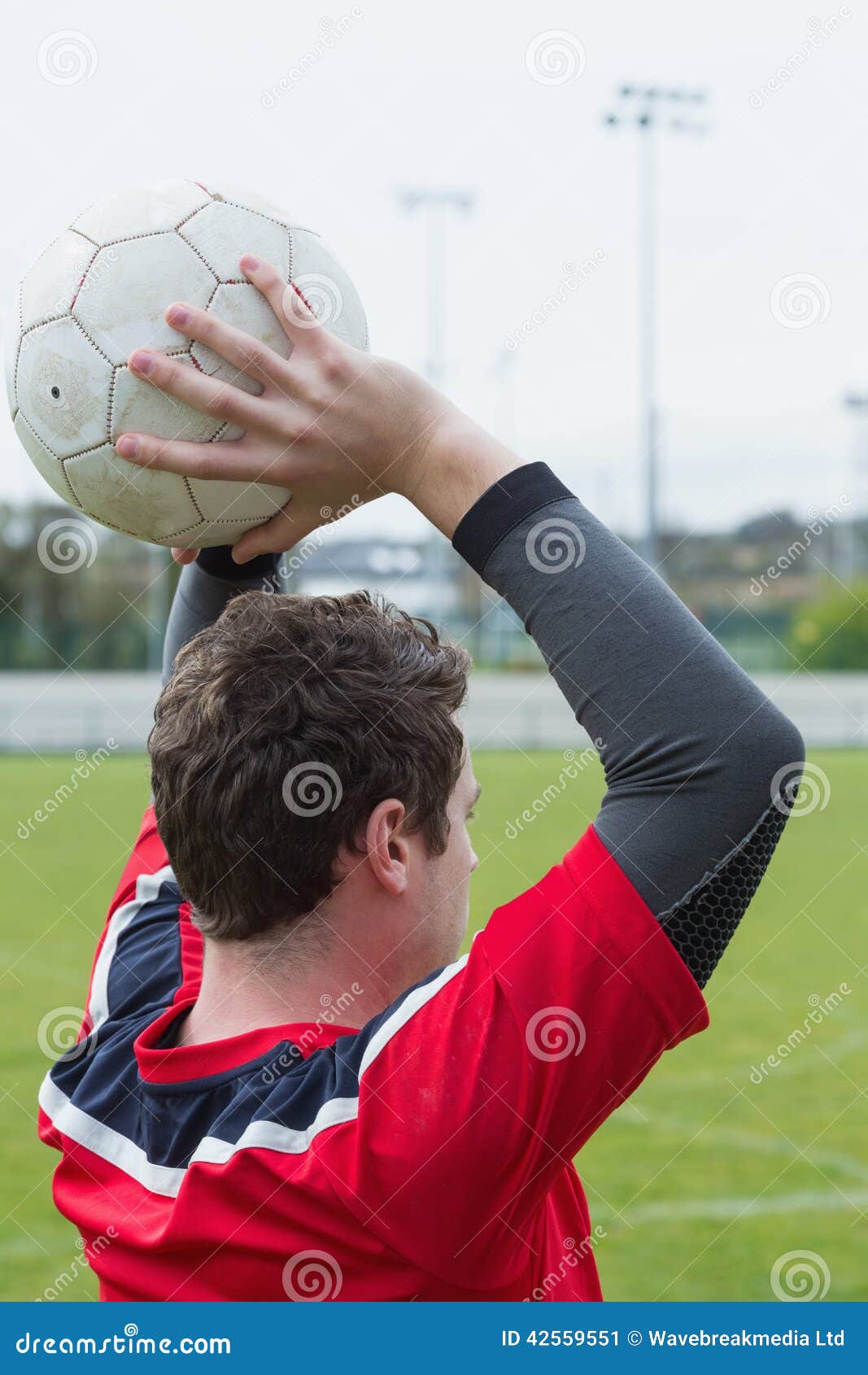 Football Player in Red Throwing from Sideline Stock Image - Image of ...