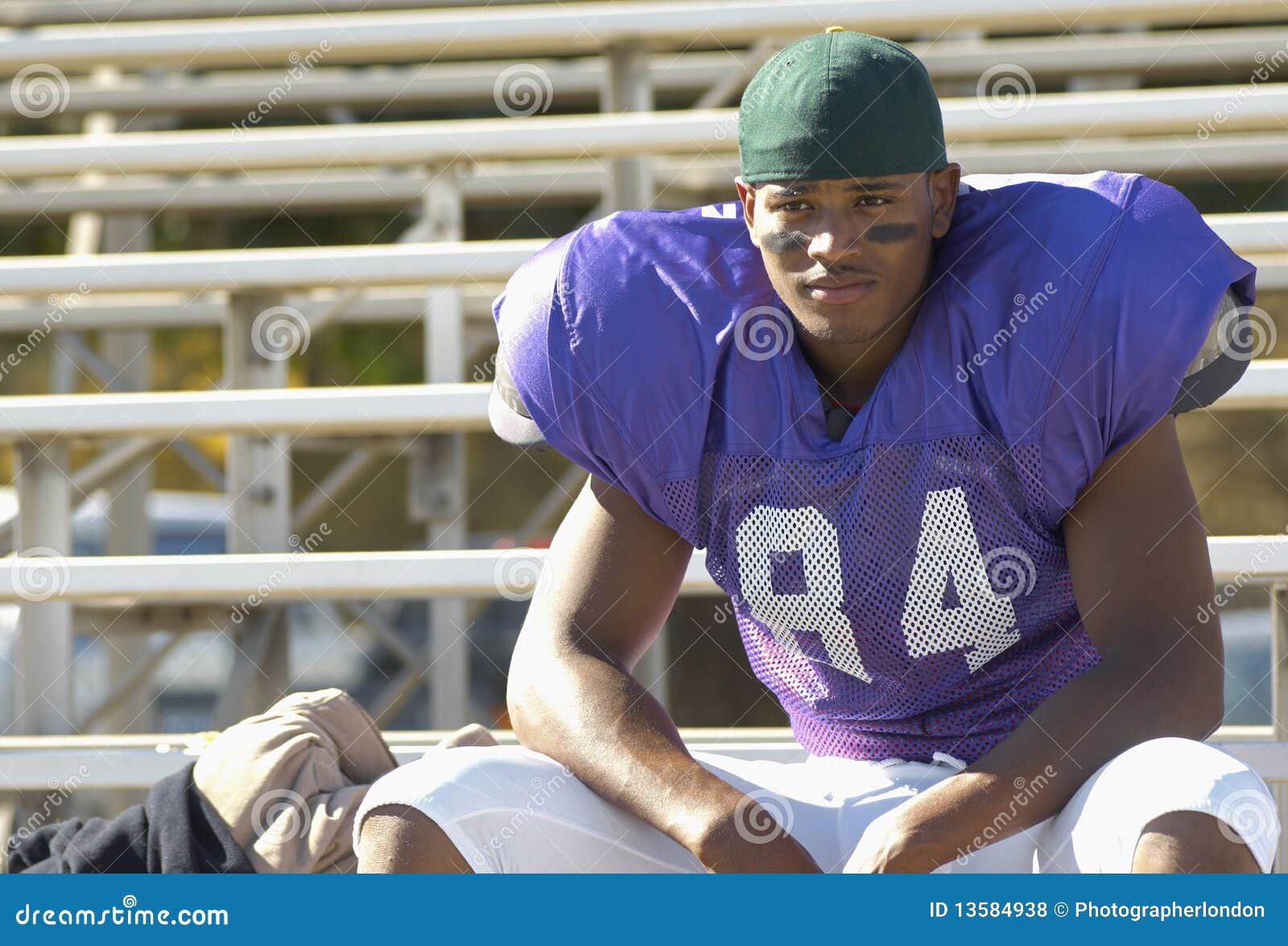 Football player resting stock photo. Image of watching - 13584938