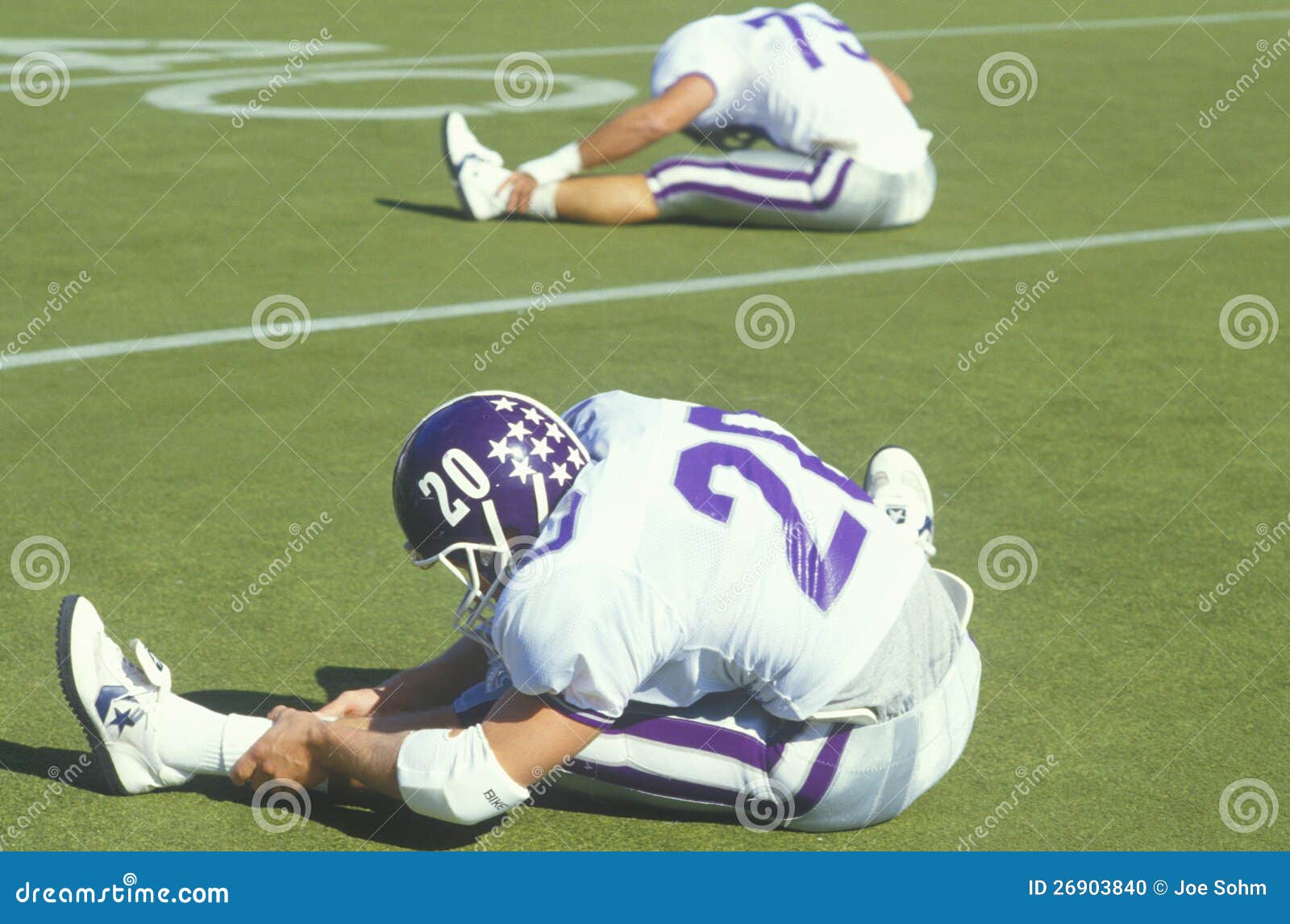 Football Player Stretching on Field Editorial Image - Image of color ...