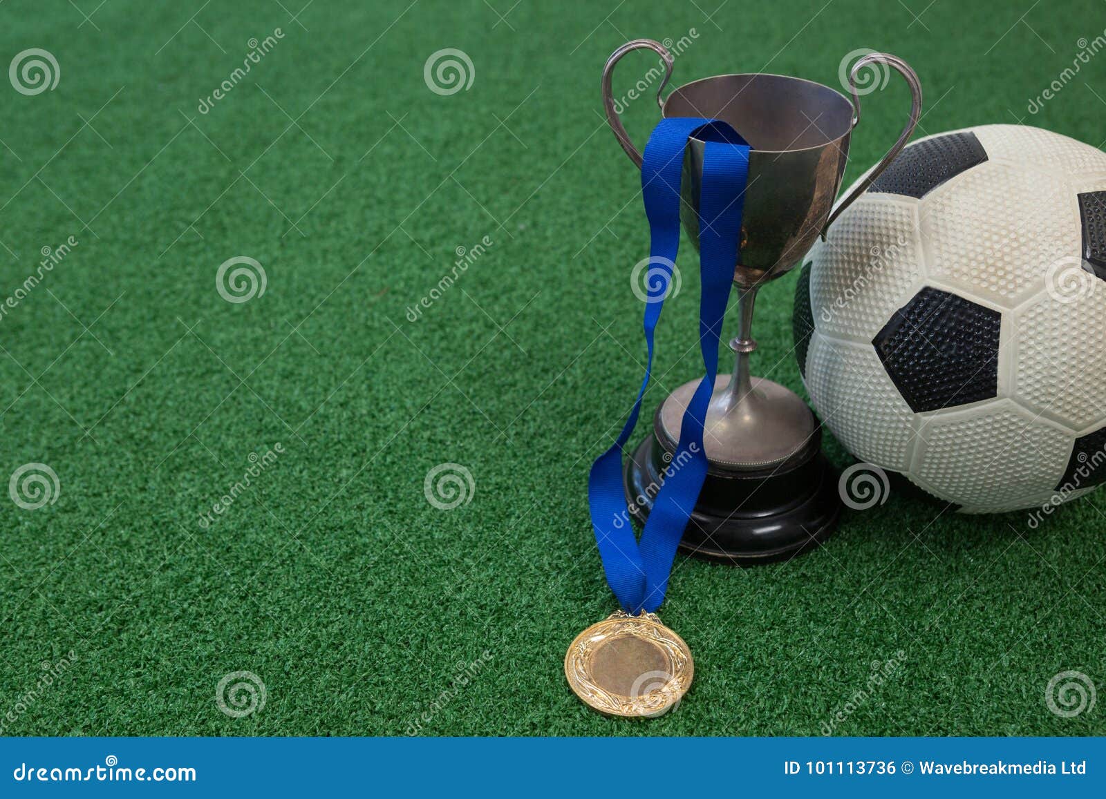 Football, Trophy and Medal on Artificial Grass Stock Photo - Image of ...