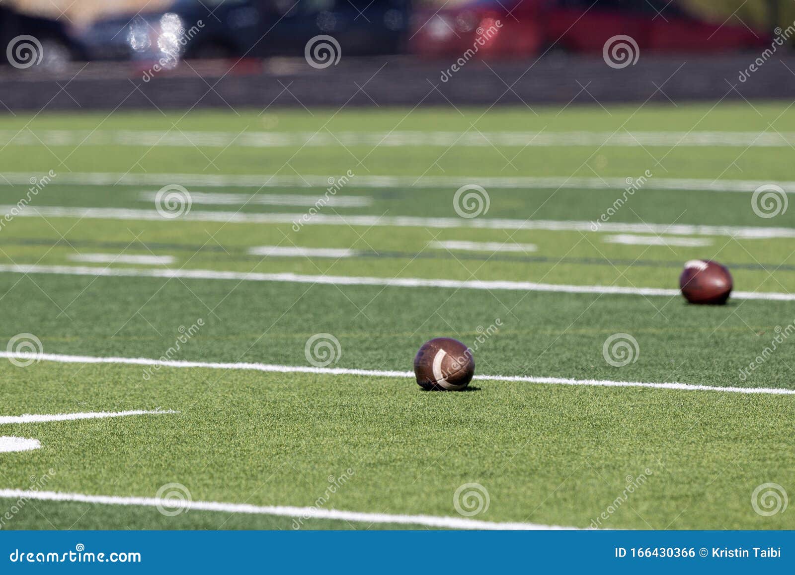 Footballs on a field stock photo. Image of laying, play - 166430366