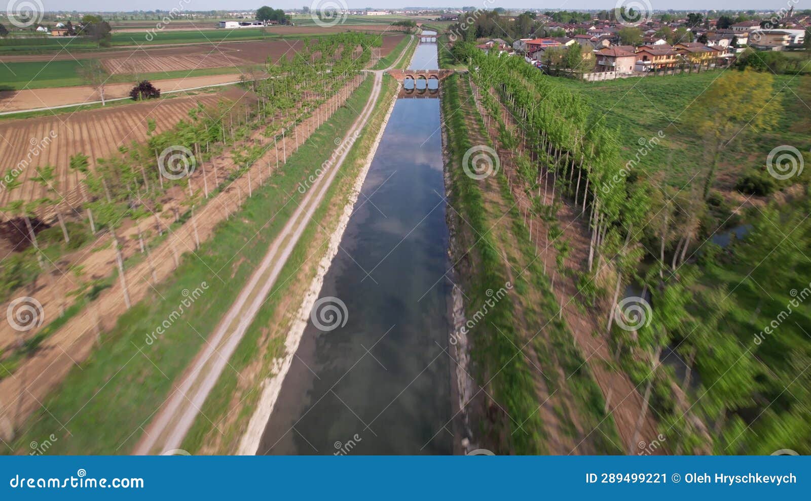 Footbridge Across the River between Fields and Tree Planting in the ...