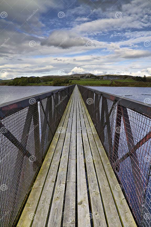 Footbridge over a lake stock image. Image of construction - 16625103