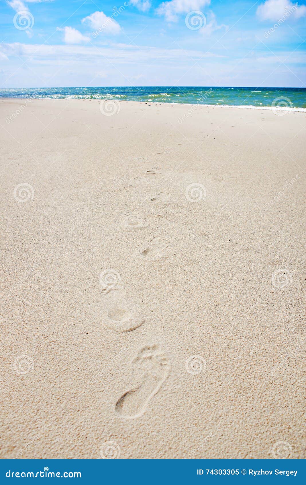 Footprints on empty beach stock image. Image of island - 74303305