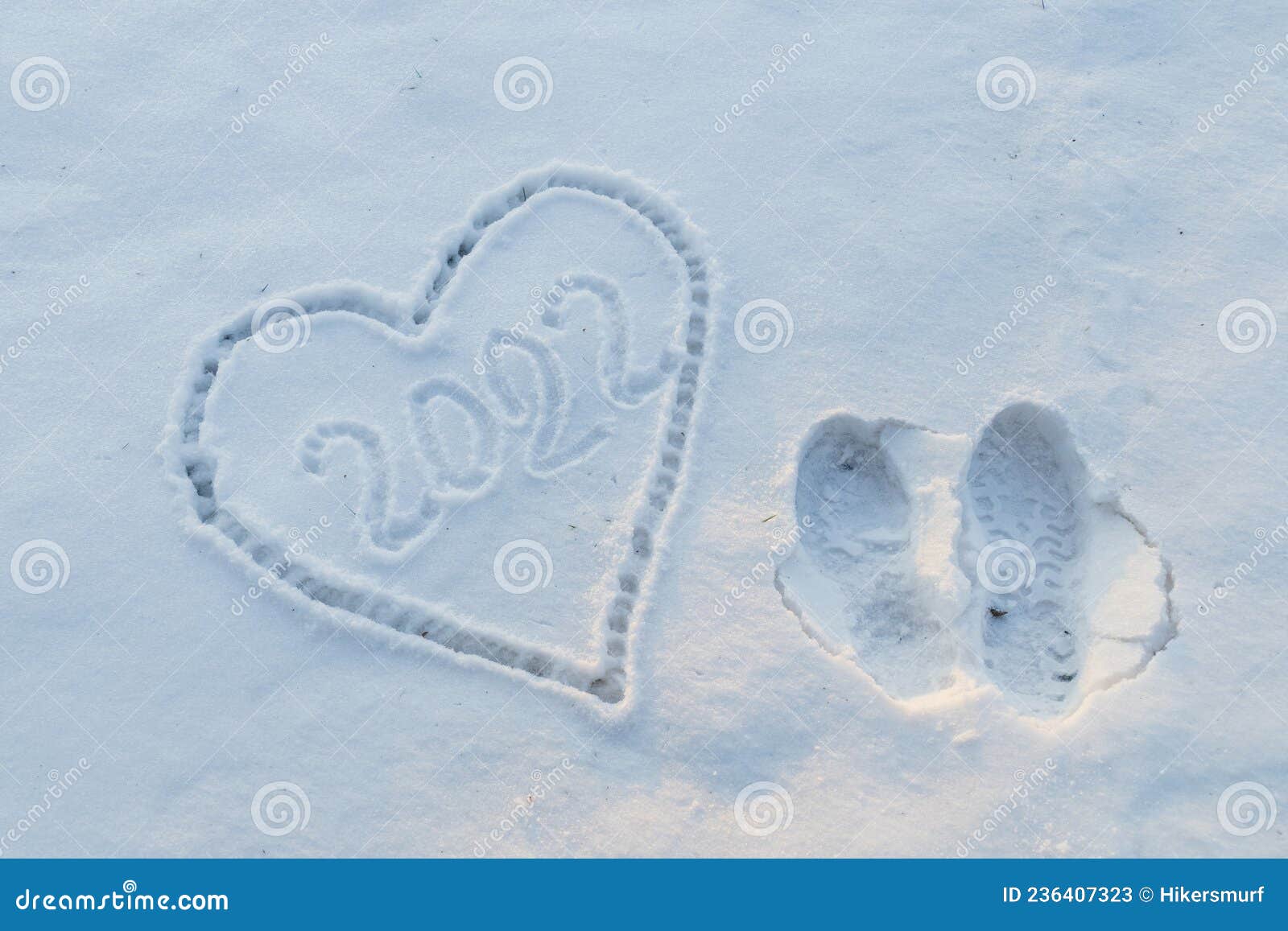 Footprints a Heart and 2022 To Step into New Year Painted in the Snow ...
