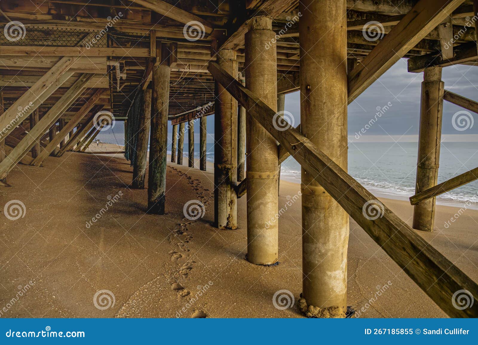 Footprints through the Pilings of the Cafe Stock Image - Image of ...