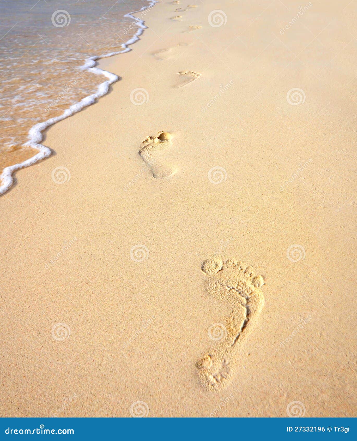 Footprints on the Sandy Beach Along the Sea Stock Photo - Image of ...