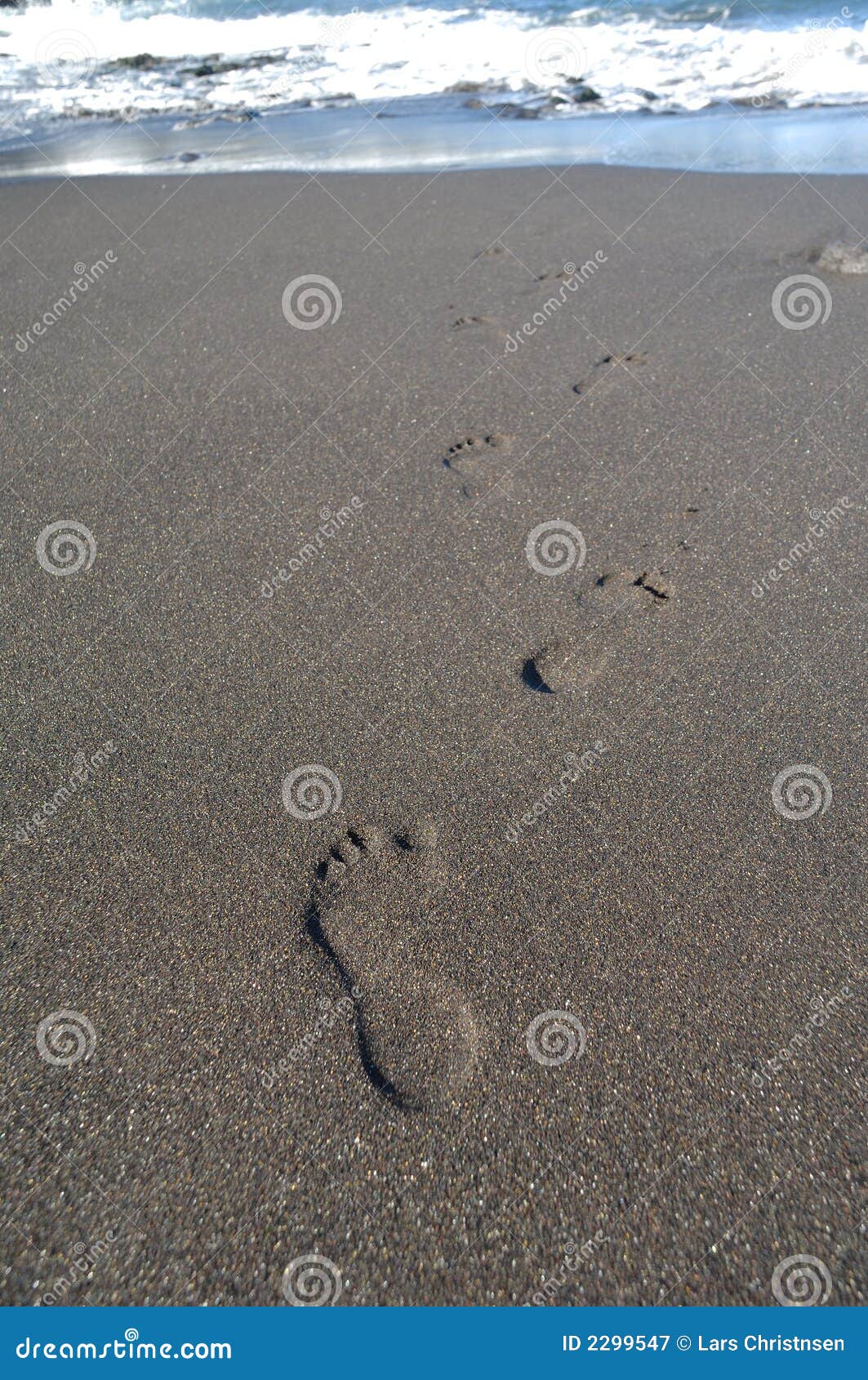 Footprints to the sea stock image. Image of people, activity - 2299547