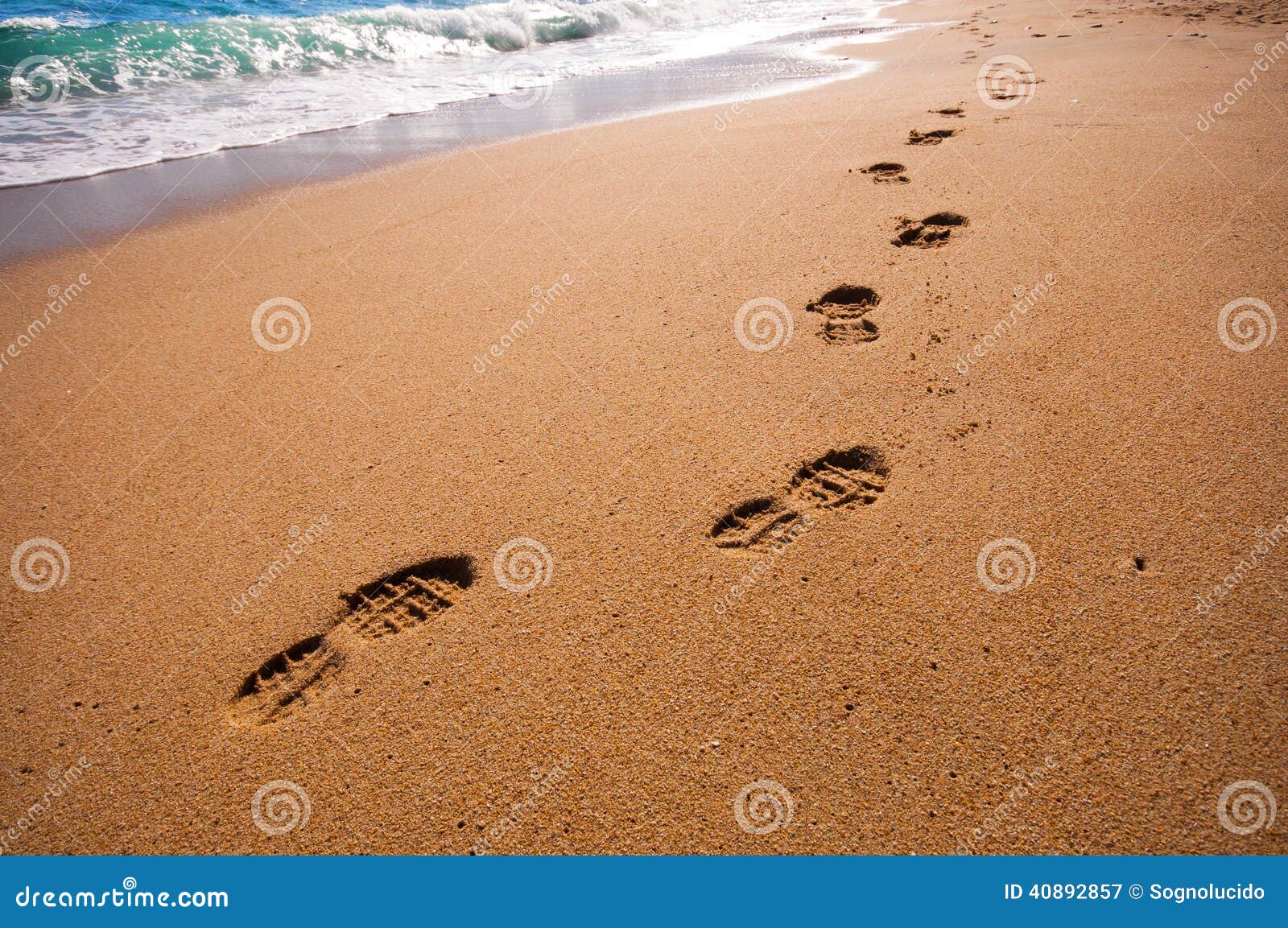Footsteps on the beach stock image. Image of footsteps - 40892857