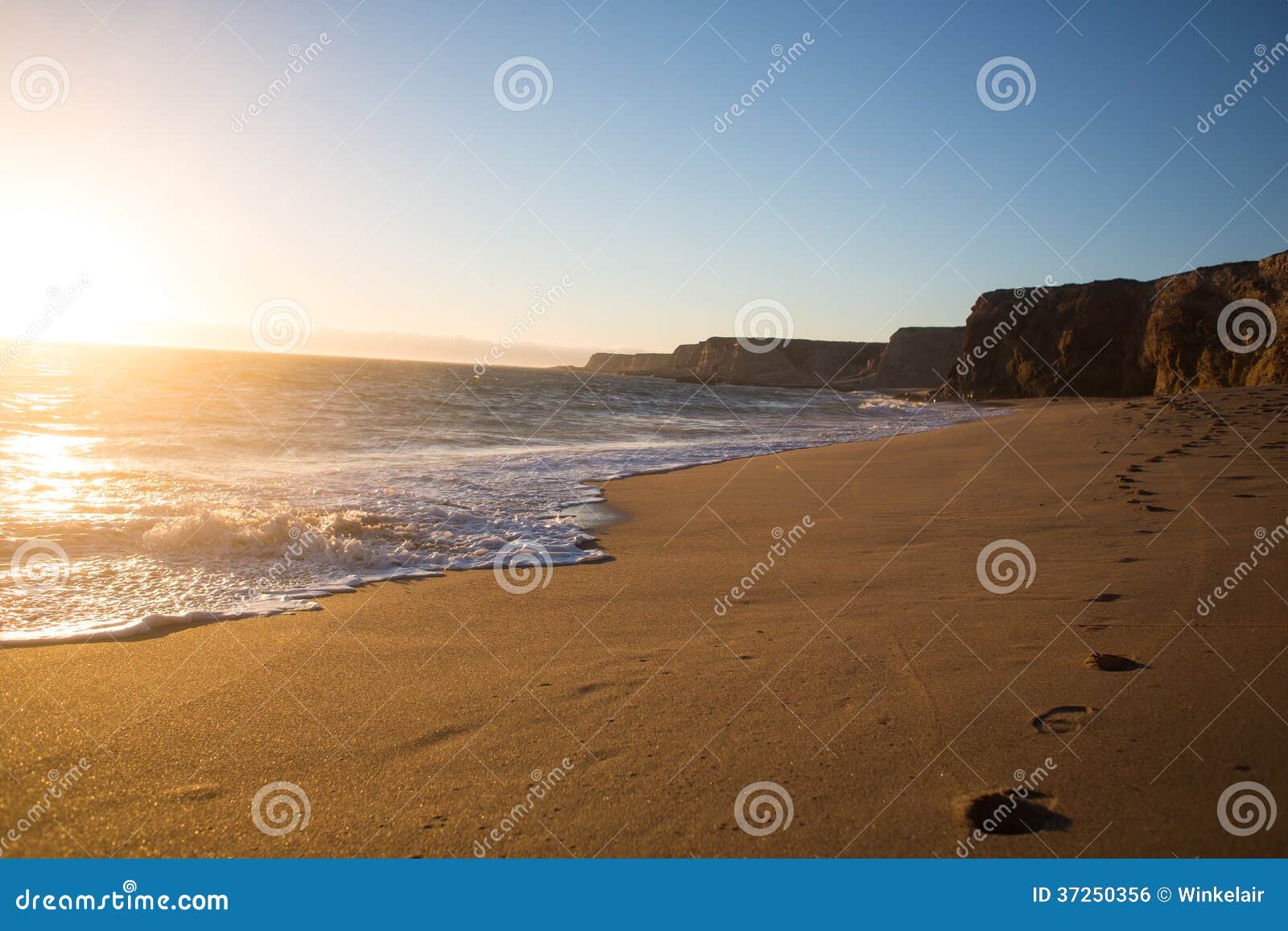 Footsteps on a Beach at Sunset Stock Photo - Image of strolling ...