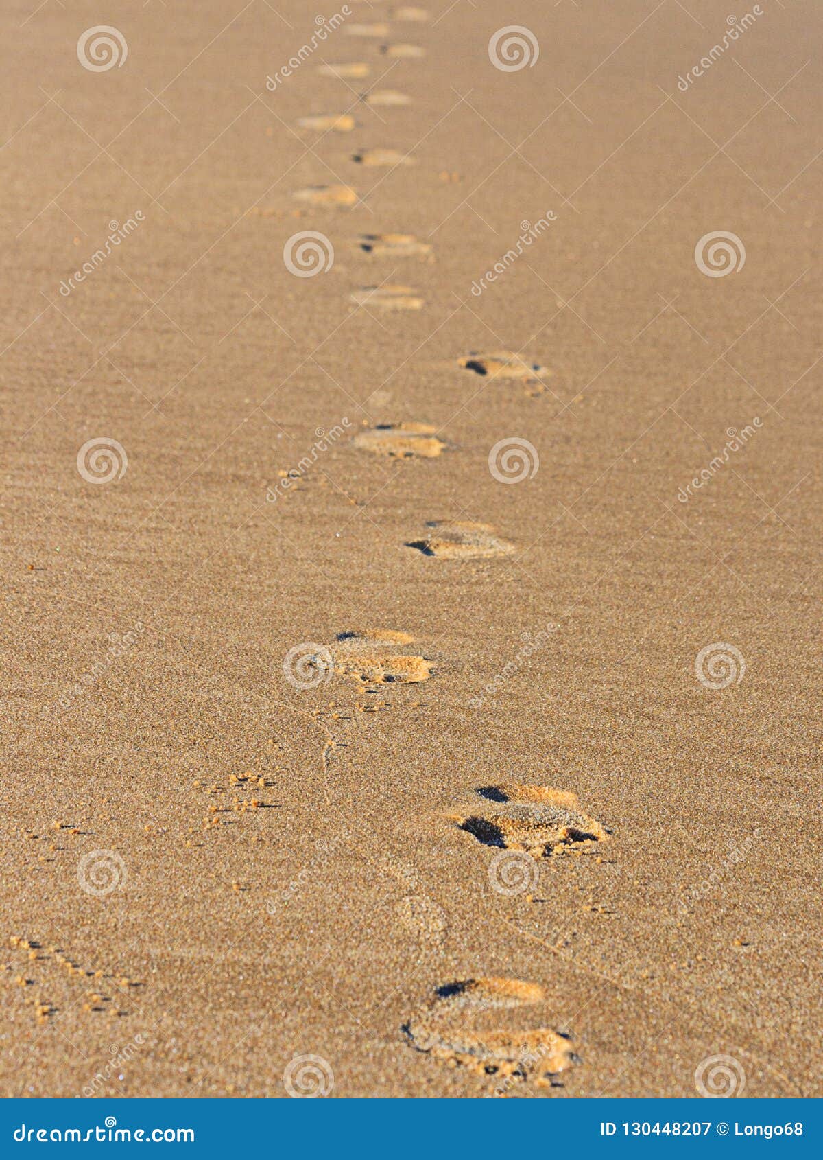 Footsteps on the beach stock image. Image of sand, close - 130448207