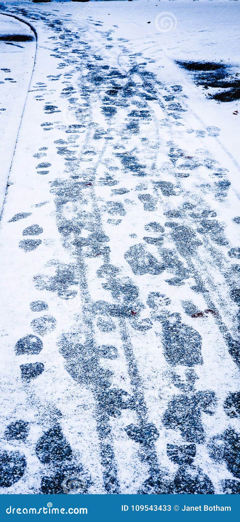 Footsteps in Snowy path stock image. Image of pavement - 109543433
