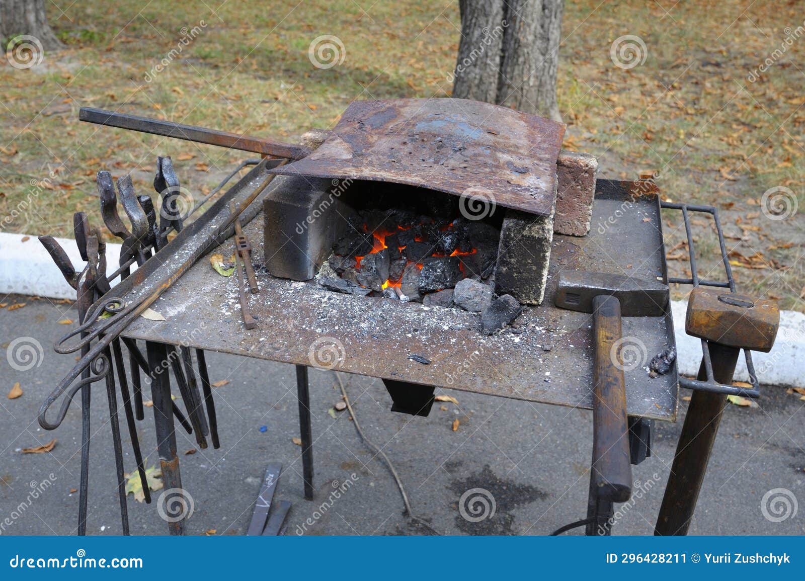 Forceps, Hammer and Burning Forge Ready for Work. at the Smithy ...
