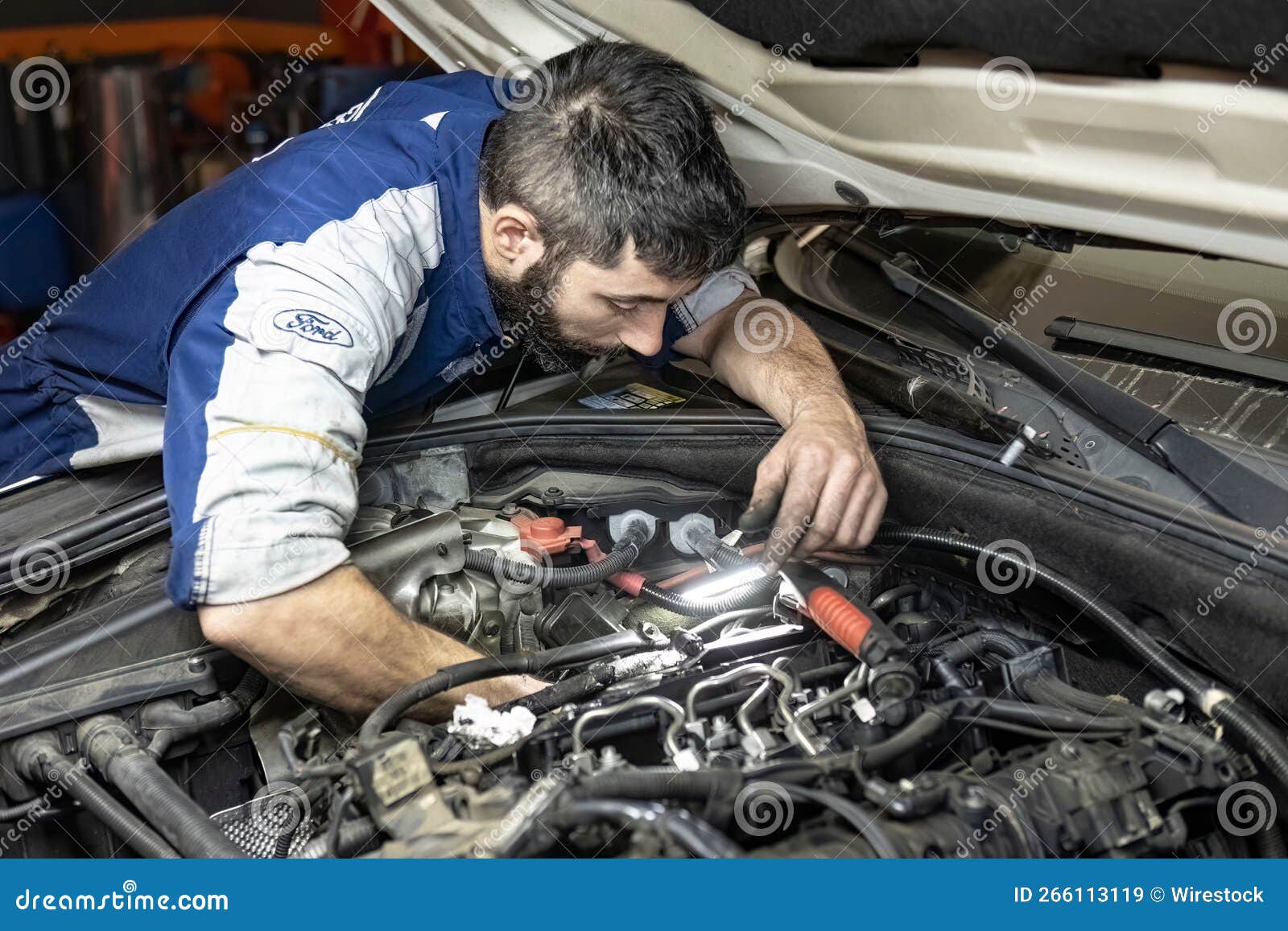 Ford Mechanic at work editorial stock image. Image of manual - 266113119