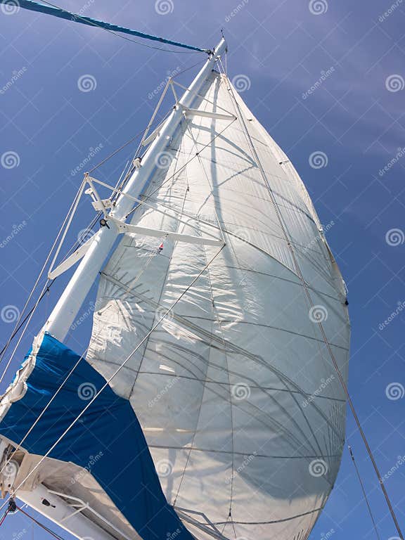Fore Sail of Catamaran Ship in Wind, Blue Sky, Vertical Stock Photo ...