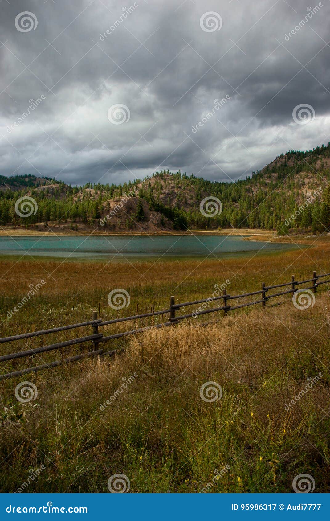 A Foreboding Sky Looming Over a Rural Okanagan Lake Stock Image - Image ...