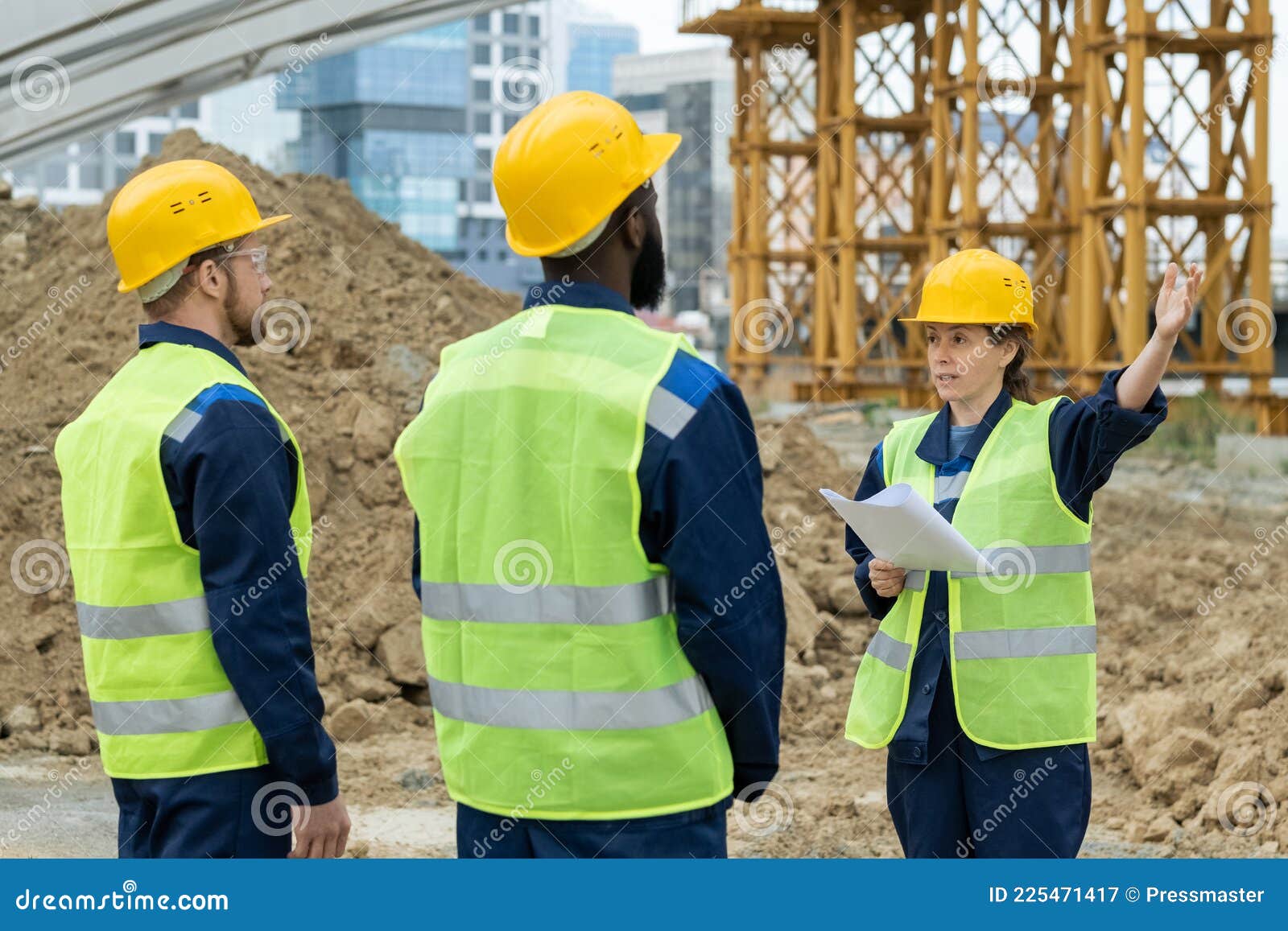 Foreman with Workers Working on Construction Site Stock Image - Image ...