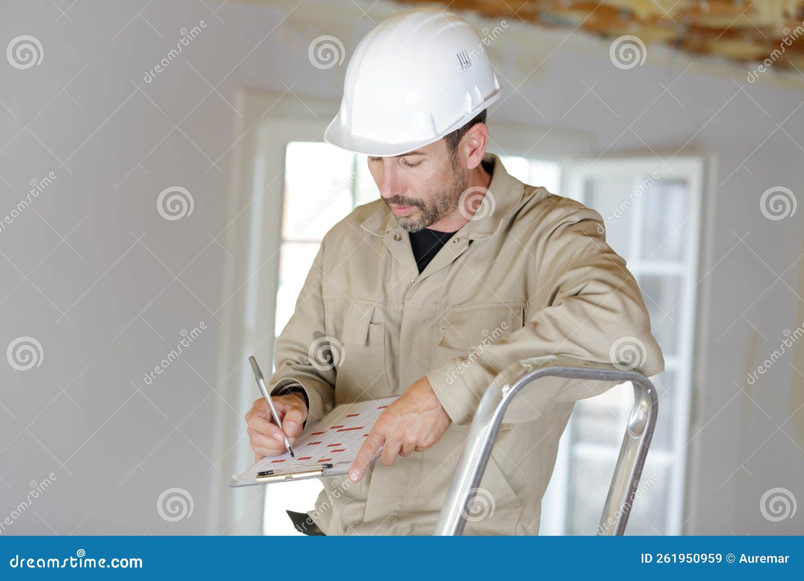 Foreman Checking Construction Papers in Clipboard Stock Image - Image ...