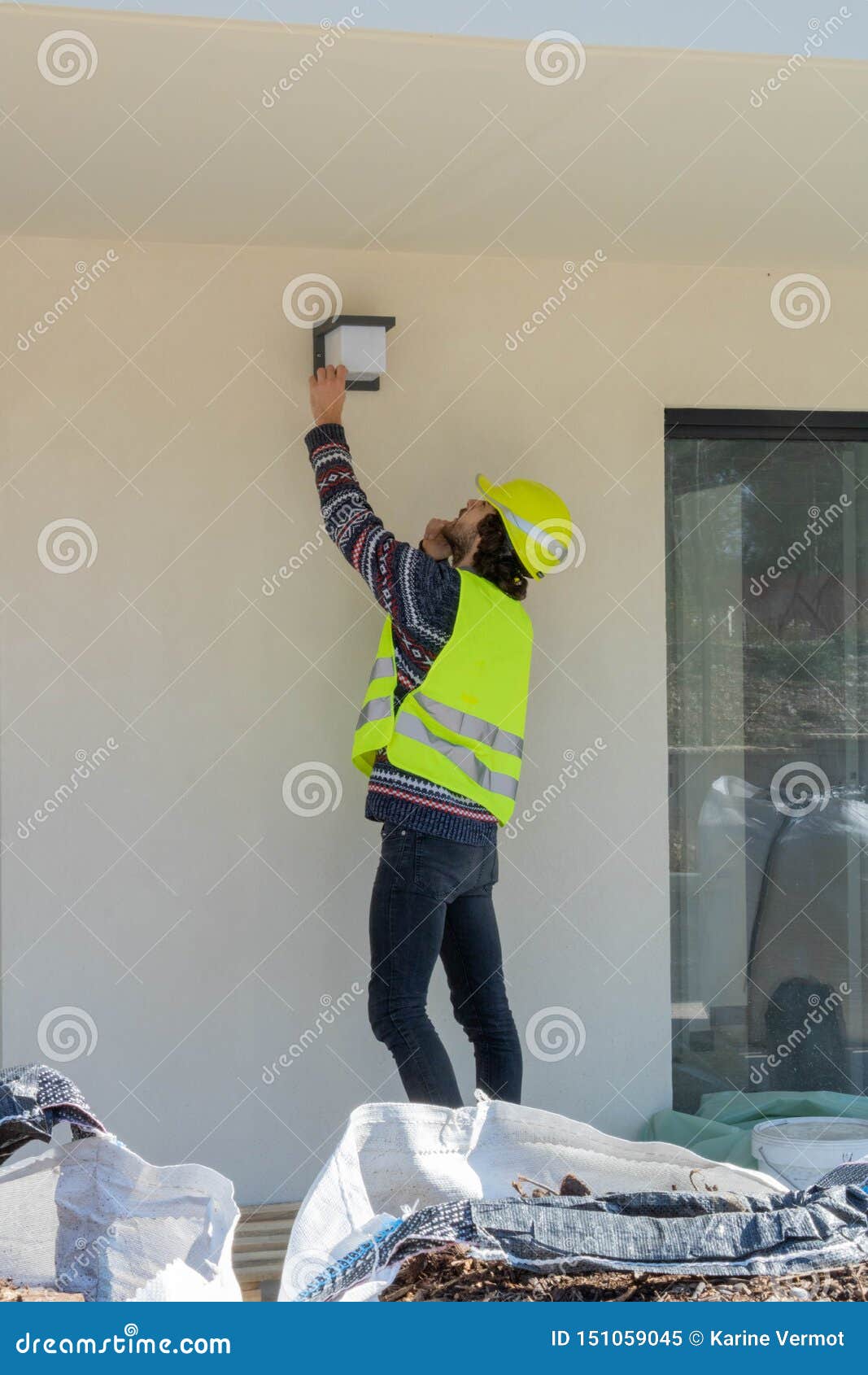 Foreman Checking the Installation of Exterior Lighting on a Building ...
