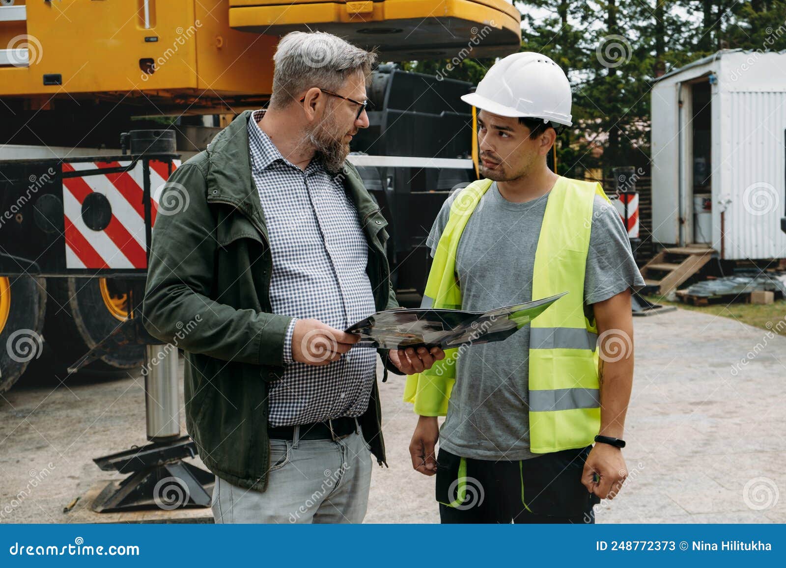 Foreman and Client Discussion Work on Construction Site Architect with ...