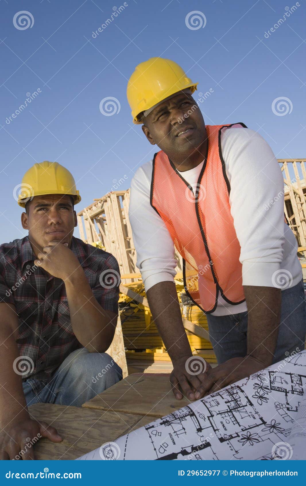 Foreman with Co-Worker Looking at Framework Stock Image - Image of ...