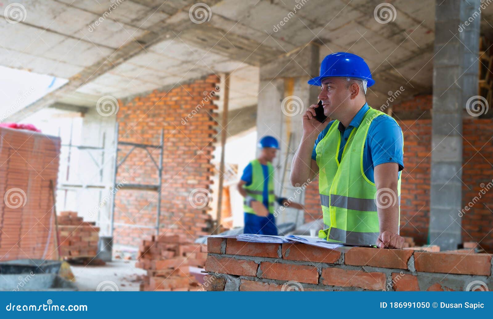 The Construction Site Manager Talking on the Phone Picture Stock Photo ...