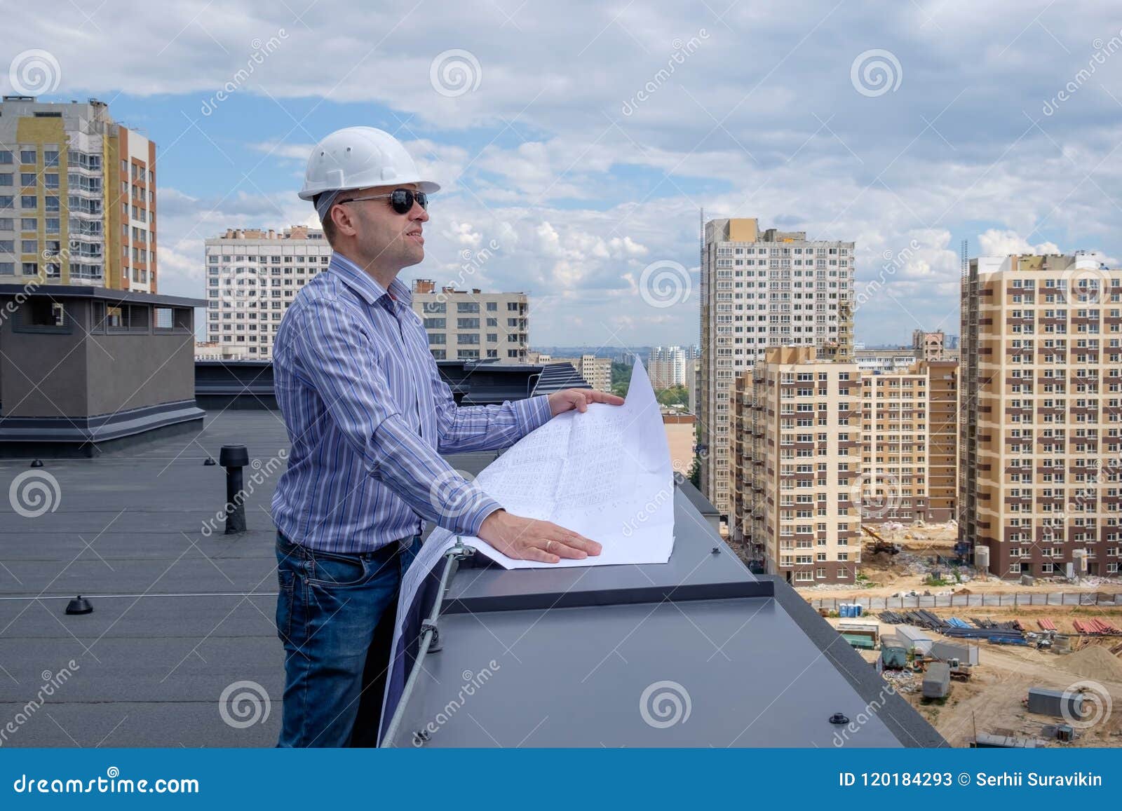 Foreman or Developer in White Helmet and Sunglasses on Roof are Looking ...