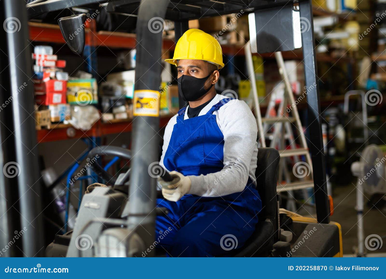 Foreman Drives Forklift in Protective Mask at the Warehouse of Hardware ...