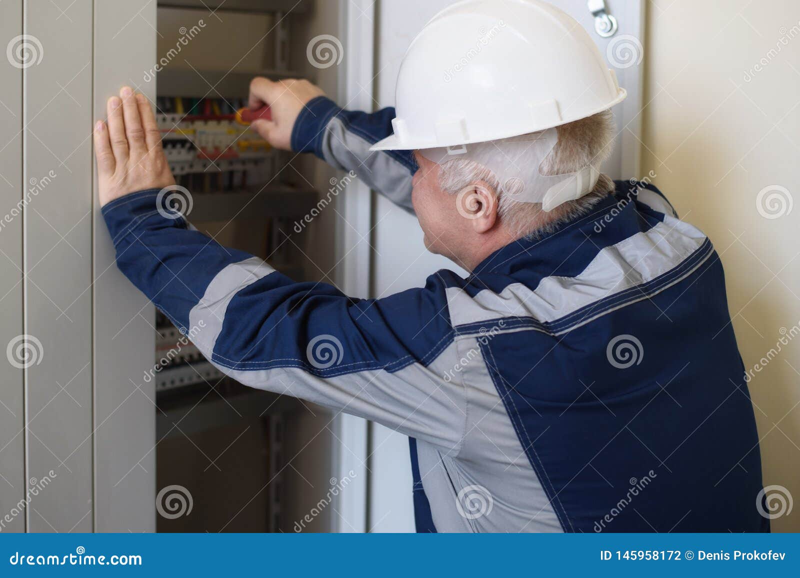 Foreman Electrician Next To the Dashboard. Energy and Electrical Safety ...