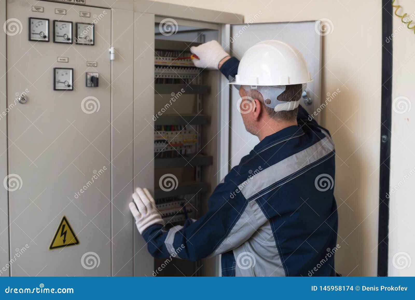 Foreman Electrician Next To the Dashboard. Energy and Electrical Safety ...