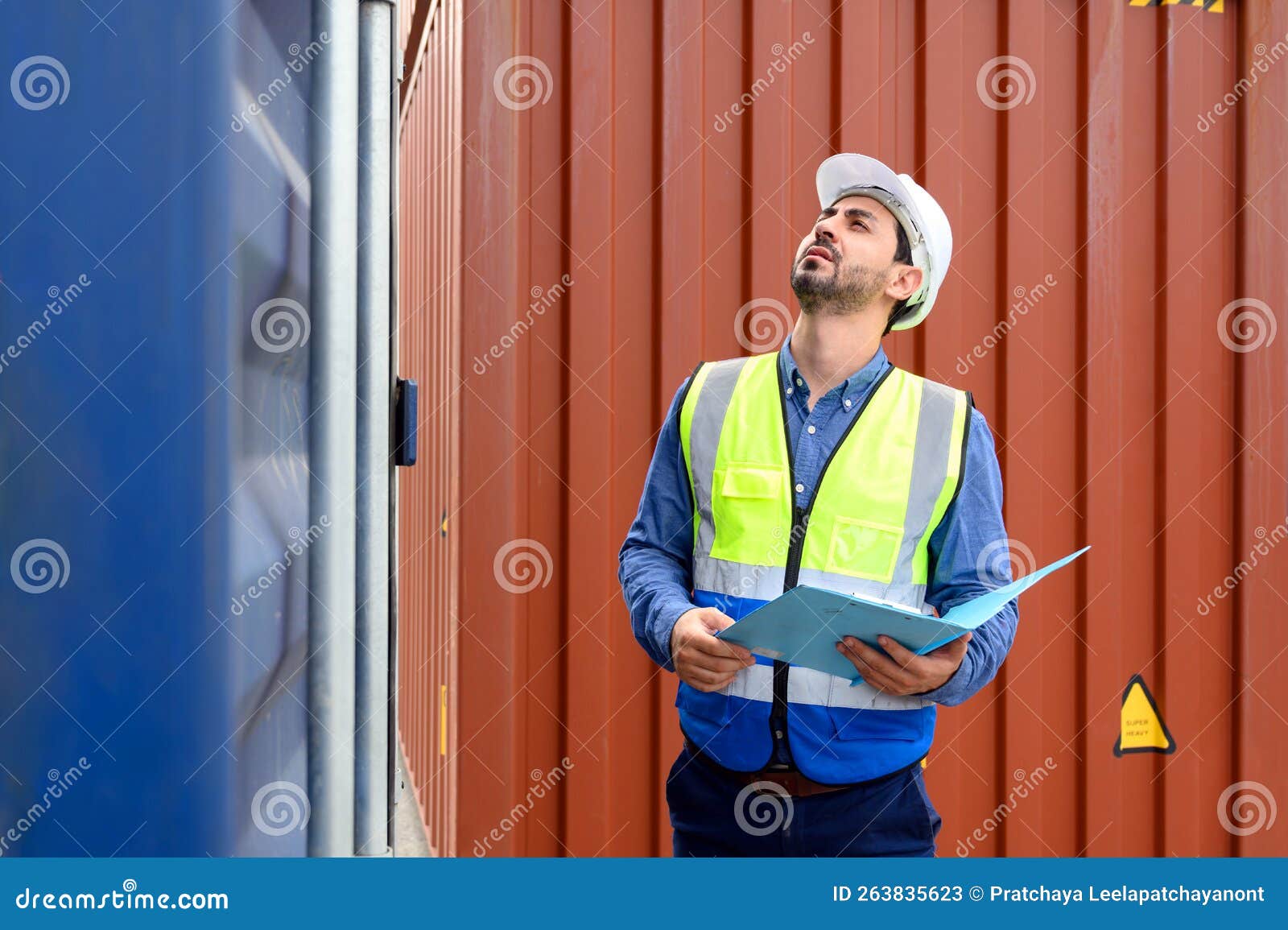Foreman or Engineer Wears White Helmet and Reflection Shirt To Control ...