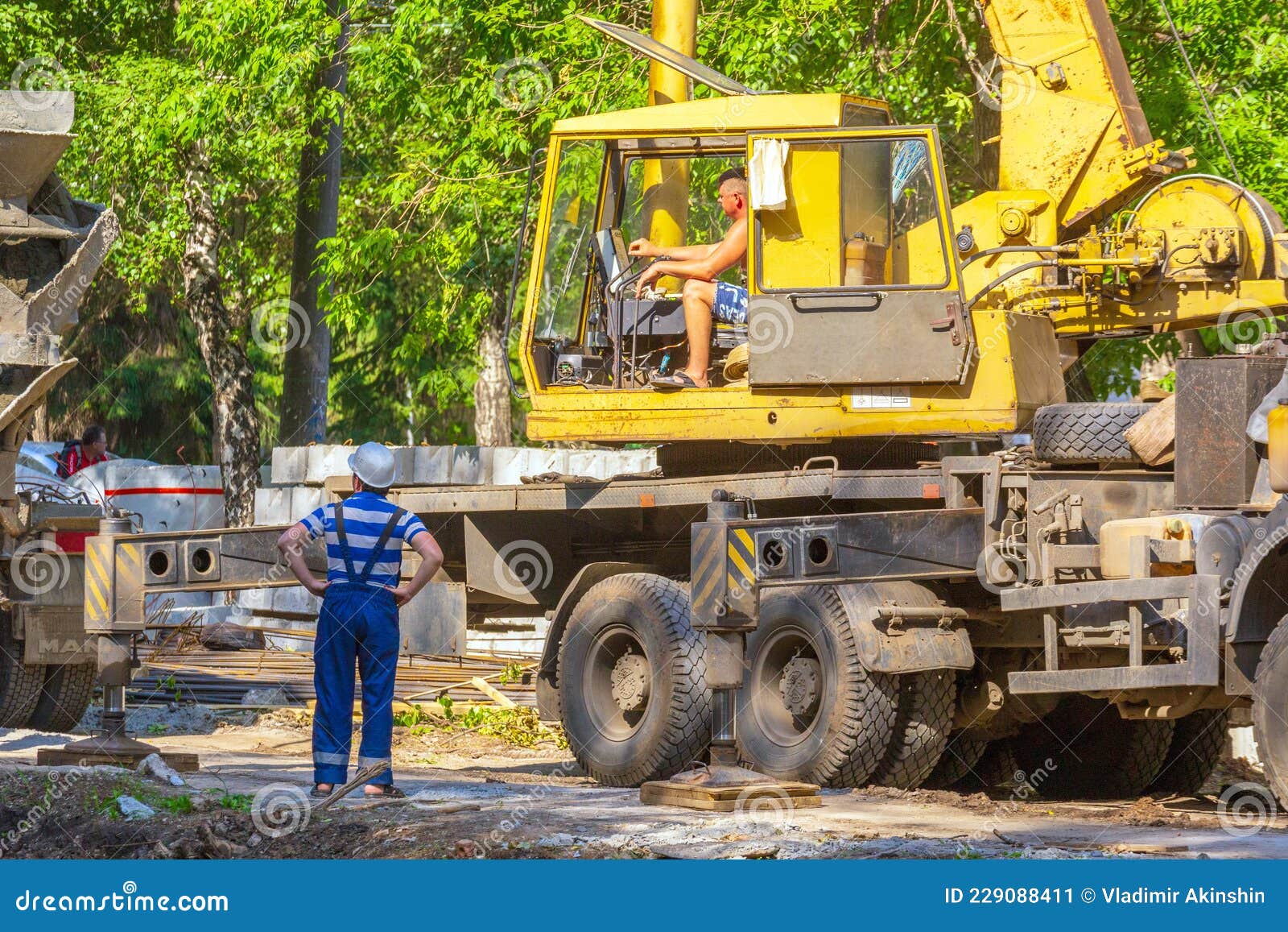 The Foreman Gives Instructions To the Working Crane Operator on the ...