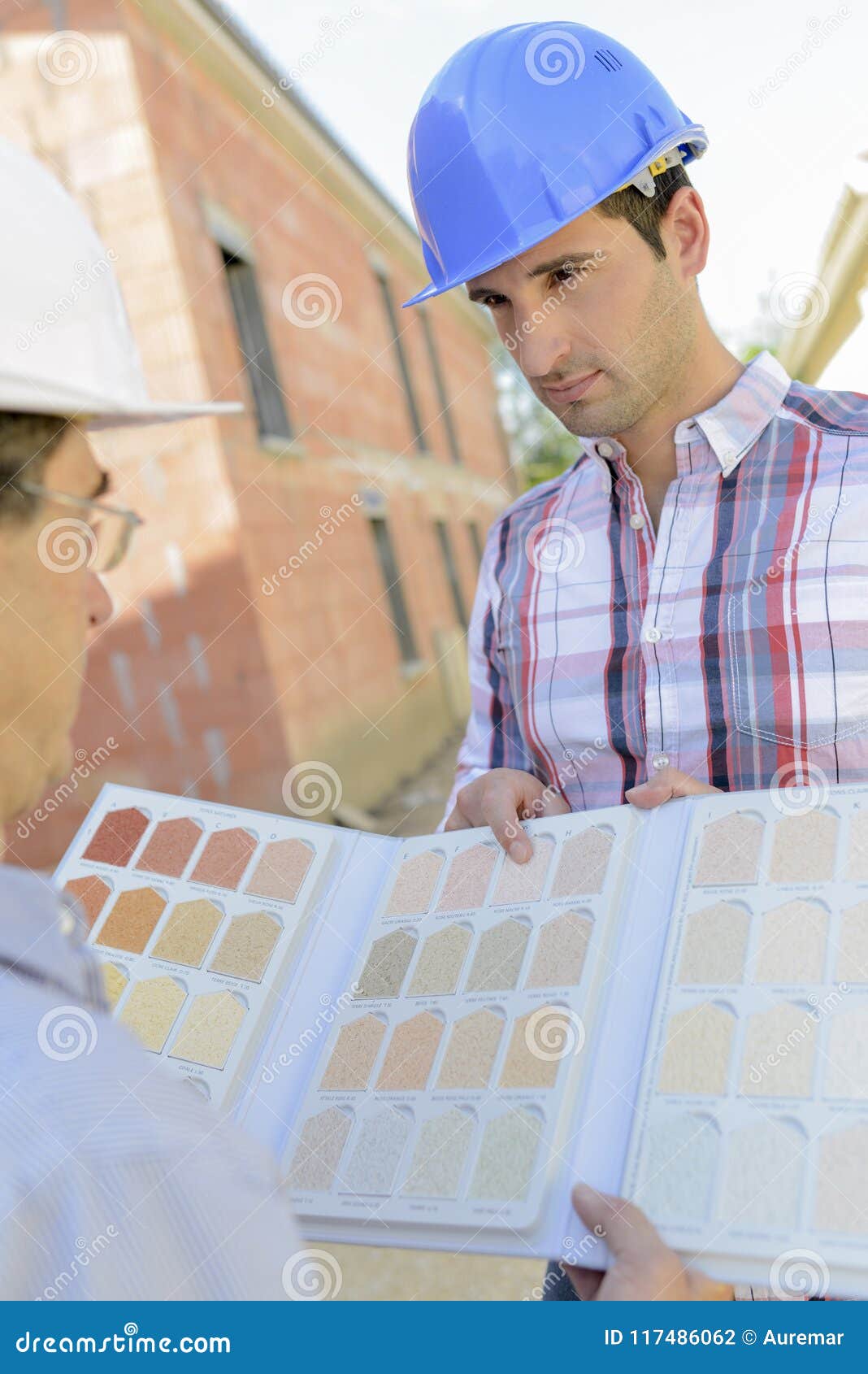 Foreman Going through Colour Options with Workers Stock Photo - Image ...