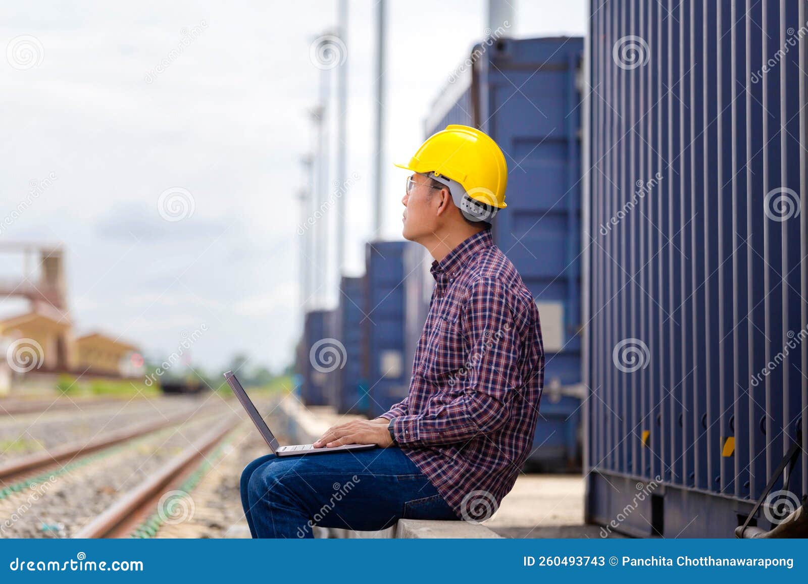 Foreman in Hardhat Checking Rail Transport Projects from Cargo ...