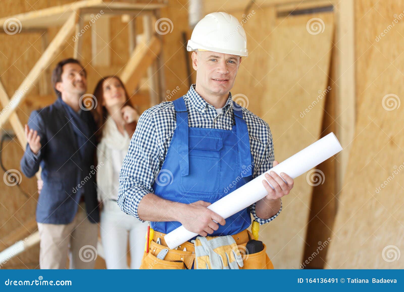 Foreman with house plans stock image. Image of happy - 164136491