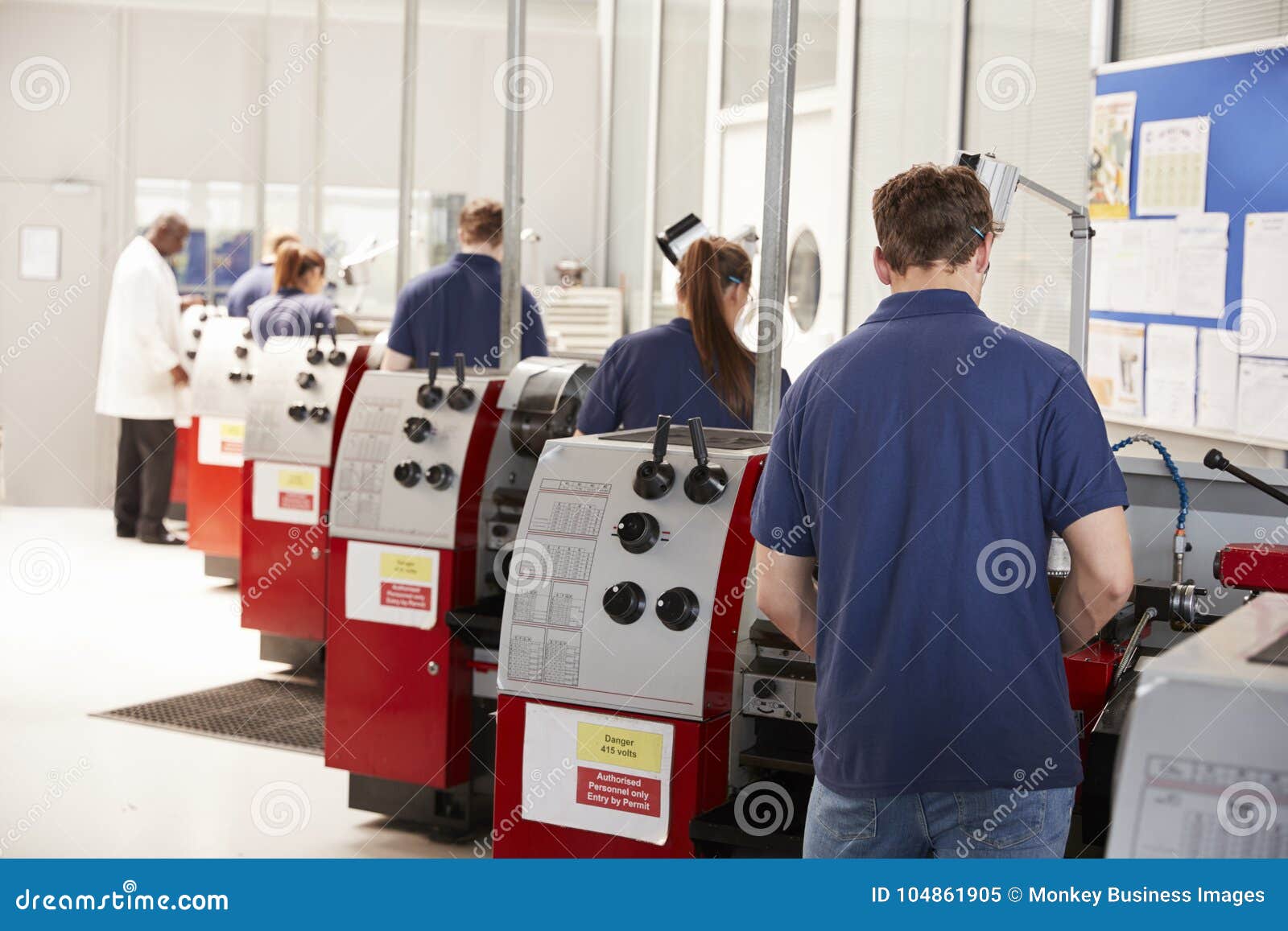 Foreman Inspecting Trainee Engineers Working in a Factory Stock Image ...